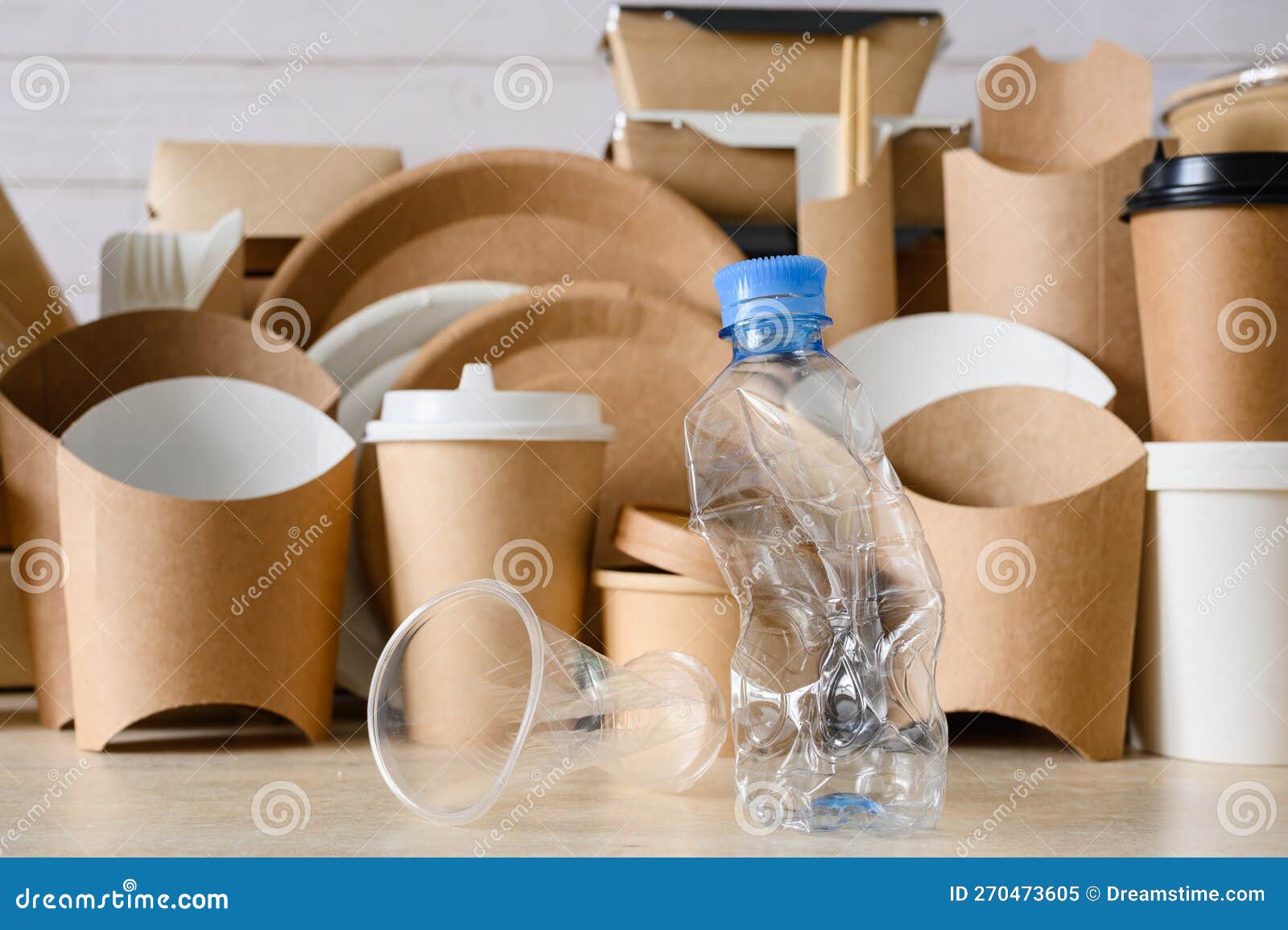 A Plastic Bottle and a Disposable Cup on the Background of Eco-friendly ...