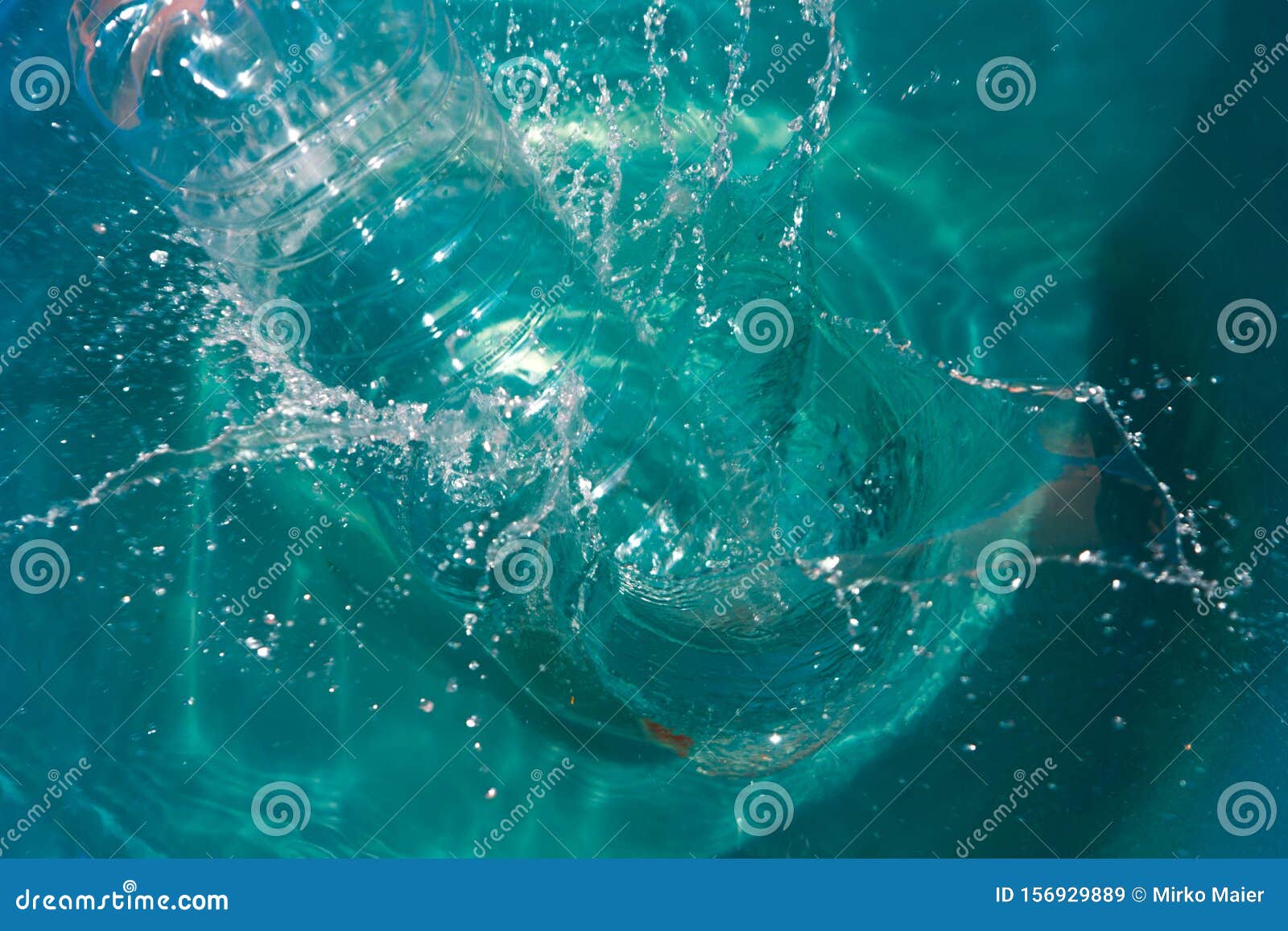 Plastic Bottle Falling into the Water Making Splashes and Spraying ...