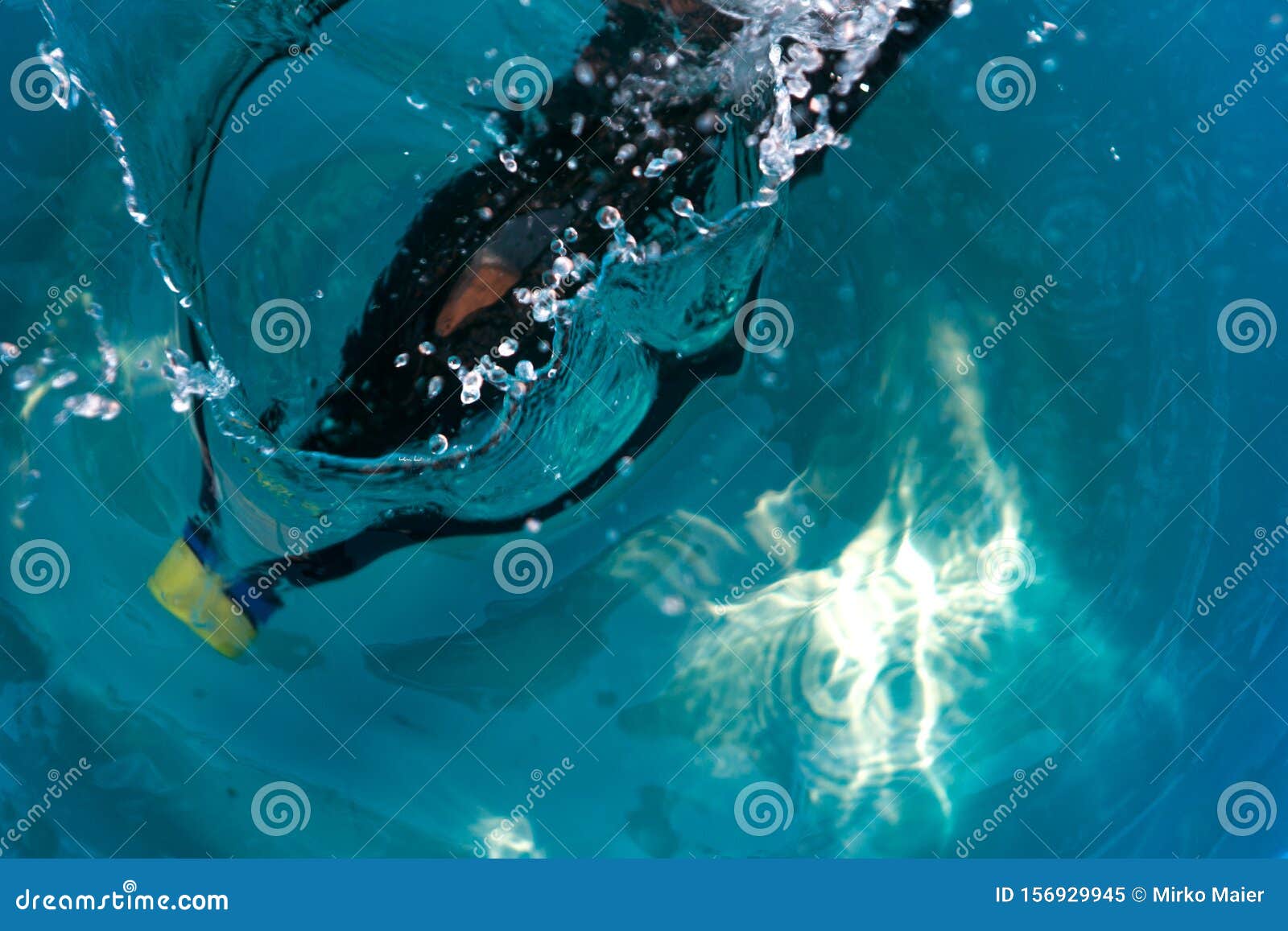 Plastic Bottle Falling into the Water Making Splashes and Spraying ...