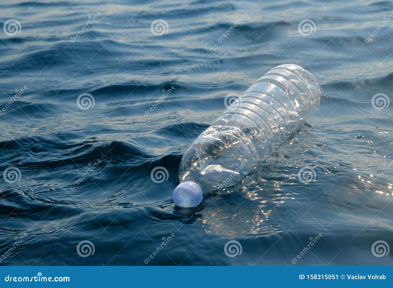 Plastic Bottle Floating in the Ocean. Stock Image - Image of floating ...