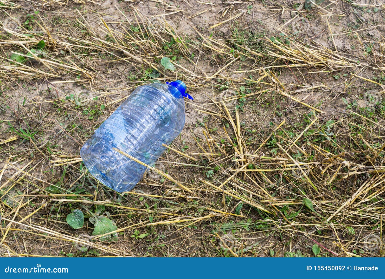 Plastic bottle on ground stock photo. Image of environment - 155450092