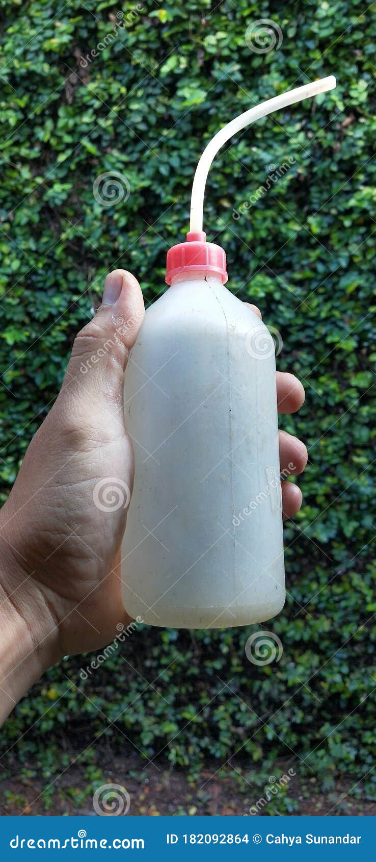 Plastic bottle in the hand stock photo. Image of liqueur - 182092864