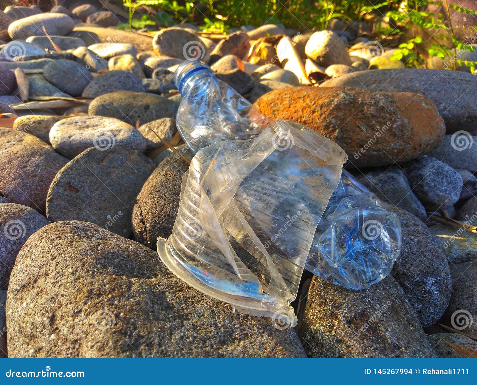 Plastic Bottle on Pile of Mountain Rocks Stock Photo - Image of nature ...