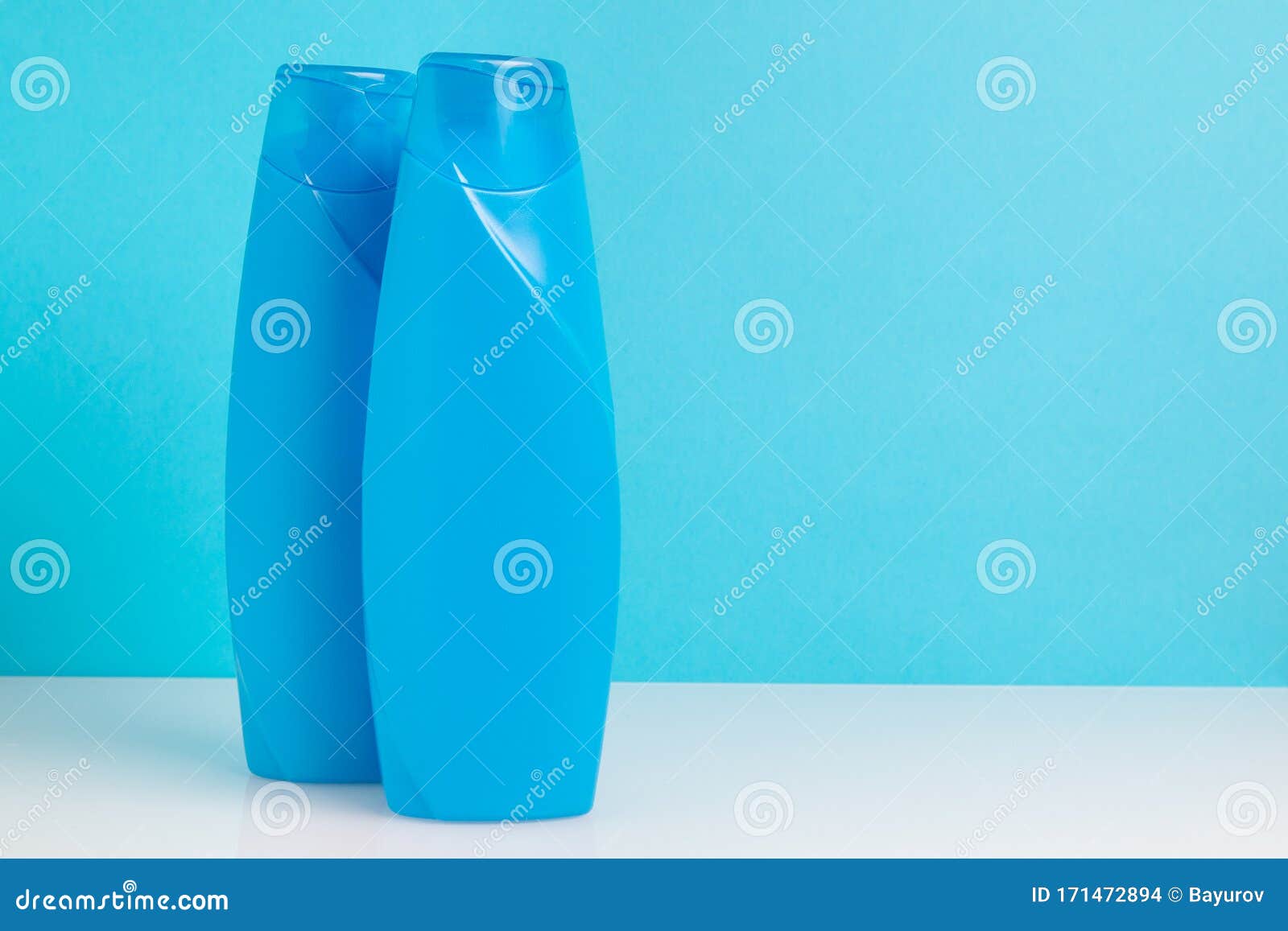 Plastic Bottle with Shampoo on a Blue Background Stock Photo - Image of ...