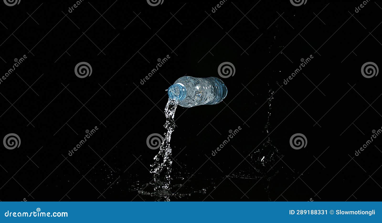 Plastic Bottle of Water Falling and Splashing Against Black Background ...