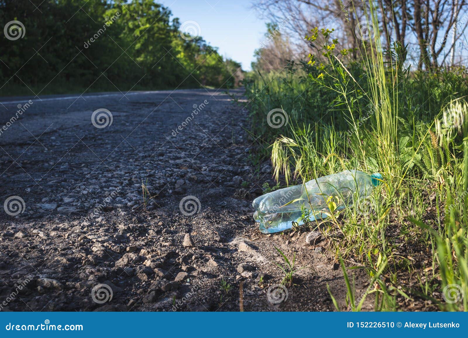 Plastic Bottle with Water by the Road Stock Photo - Image of road ...