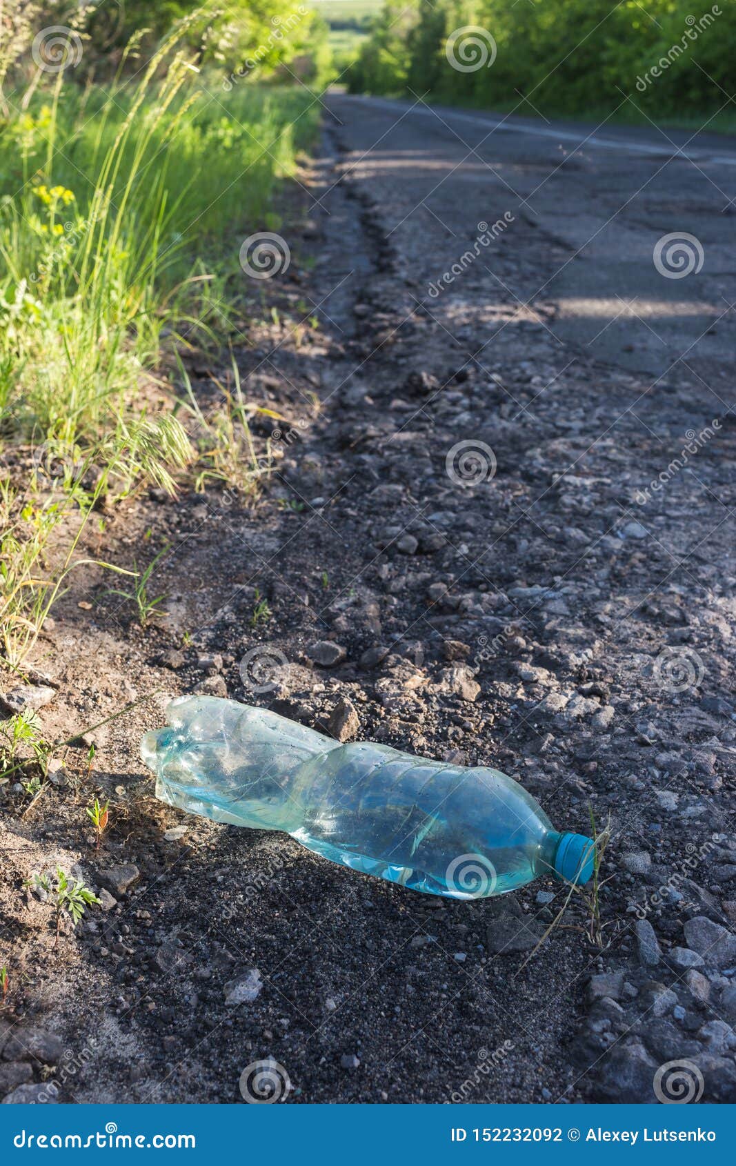 Plastic Bottle with Water by the Road Stock Photo - Image of garbage ...