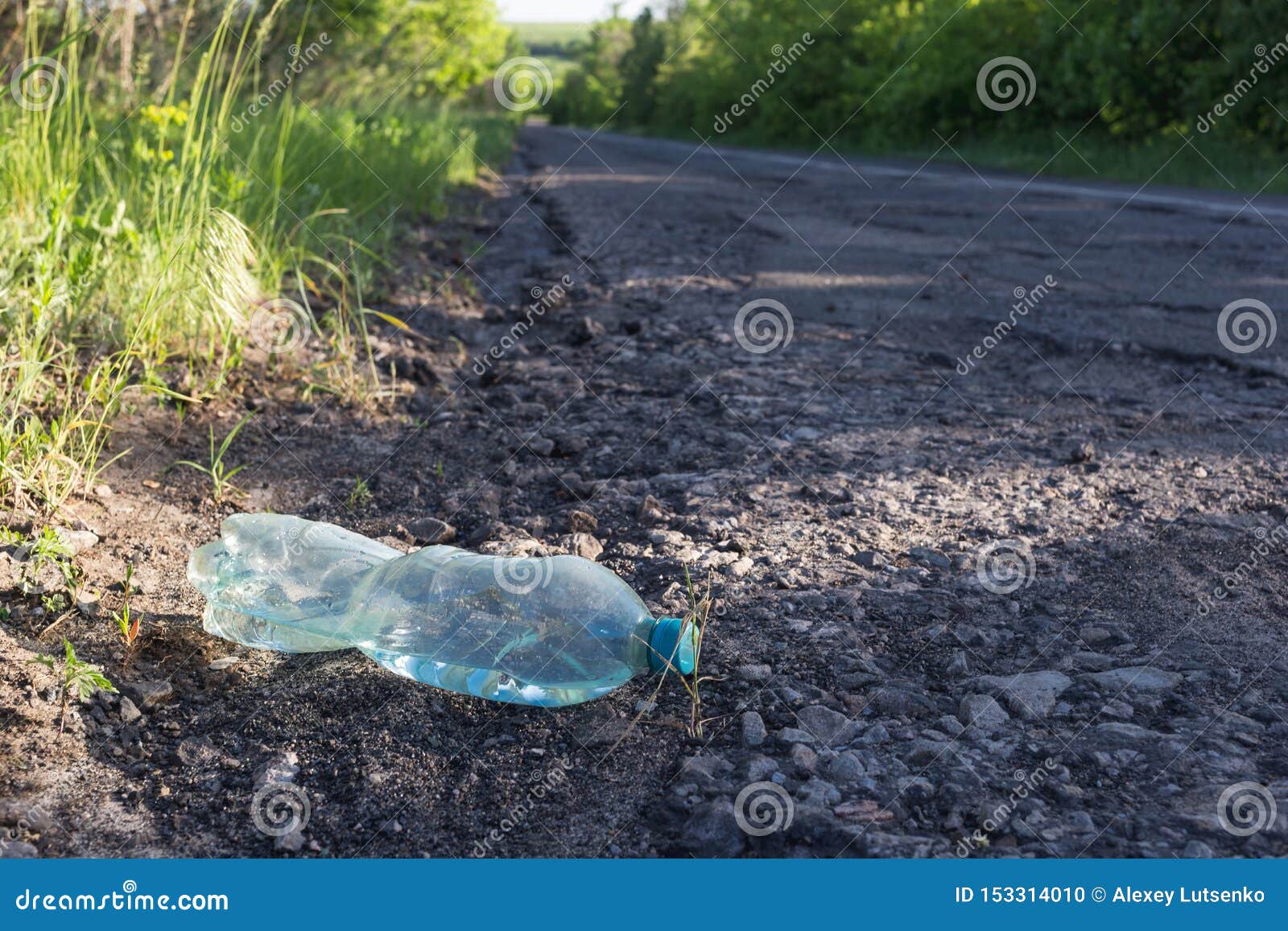 Plastic Bottle with Water by the Road Stock Photo - Image of natural ...