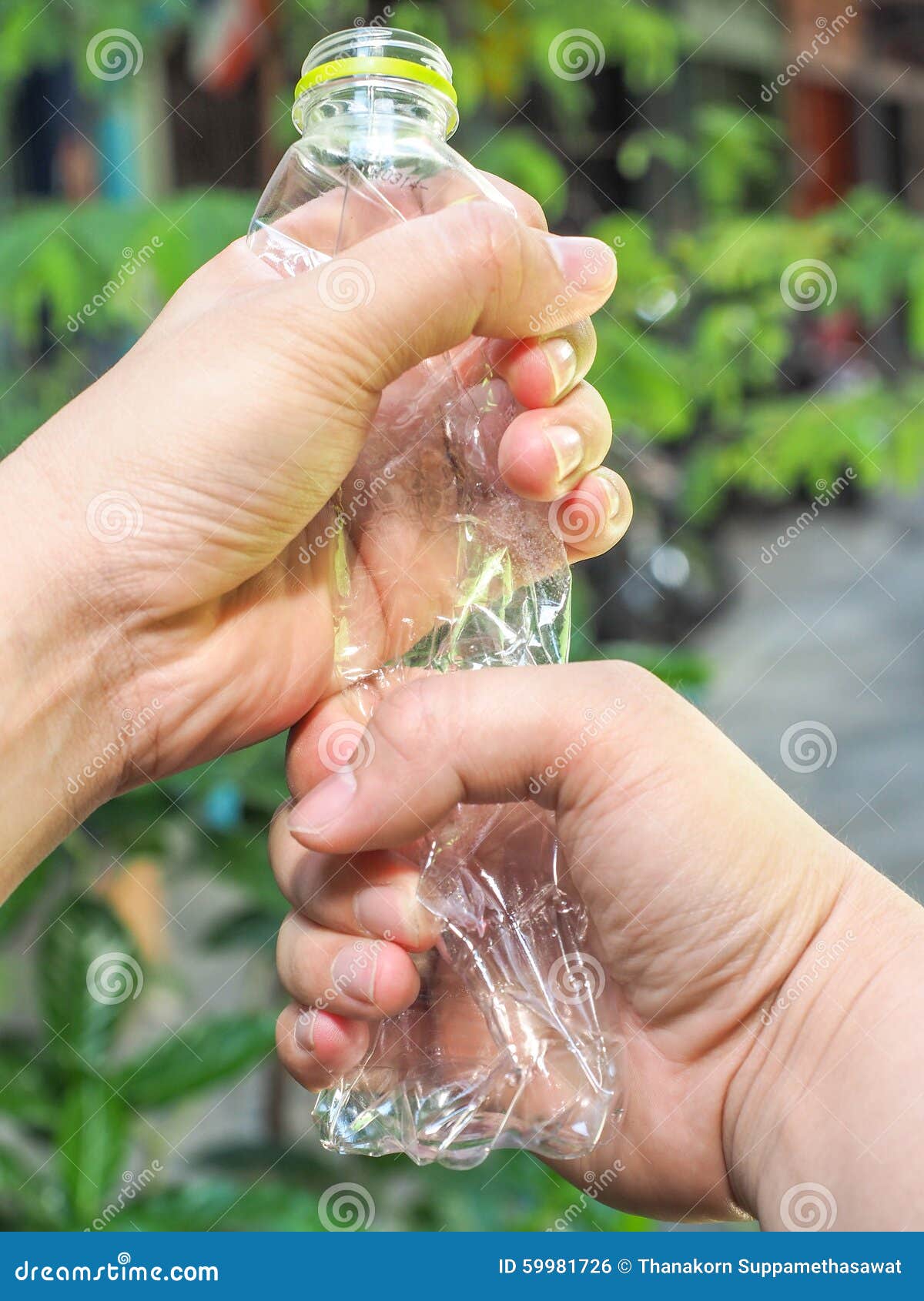Plastic Bottles by Compression on the Hand of Man . Stock Photo - Image ...