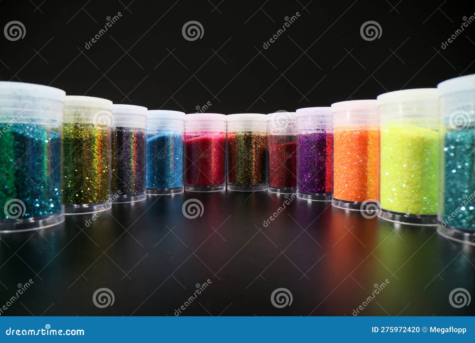 Plastic Bottles with Multi-colored Glitter Powder in Row Stock Photo ...