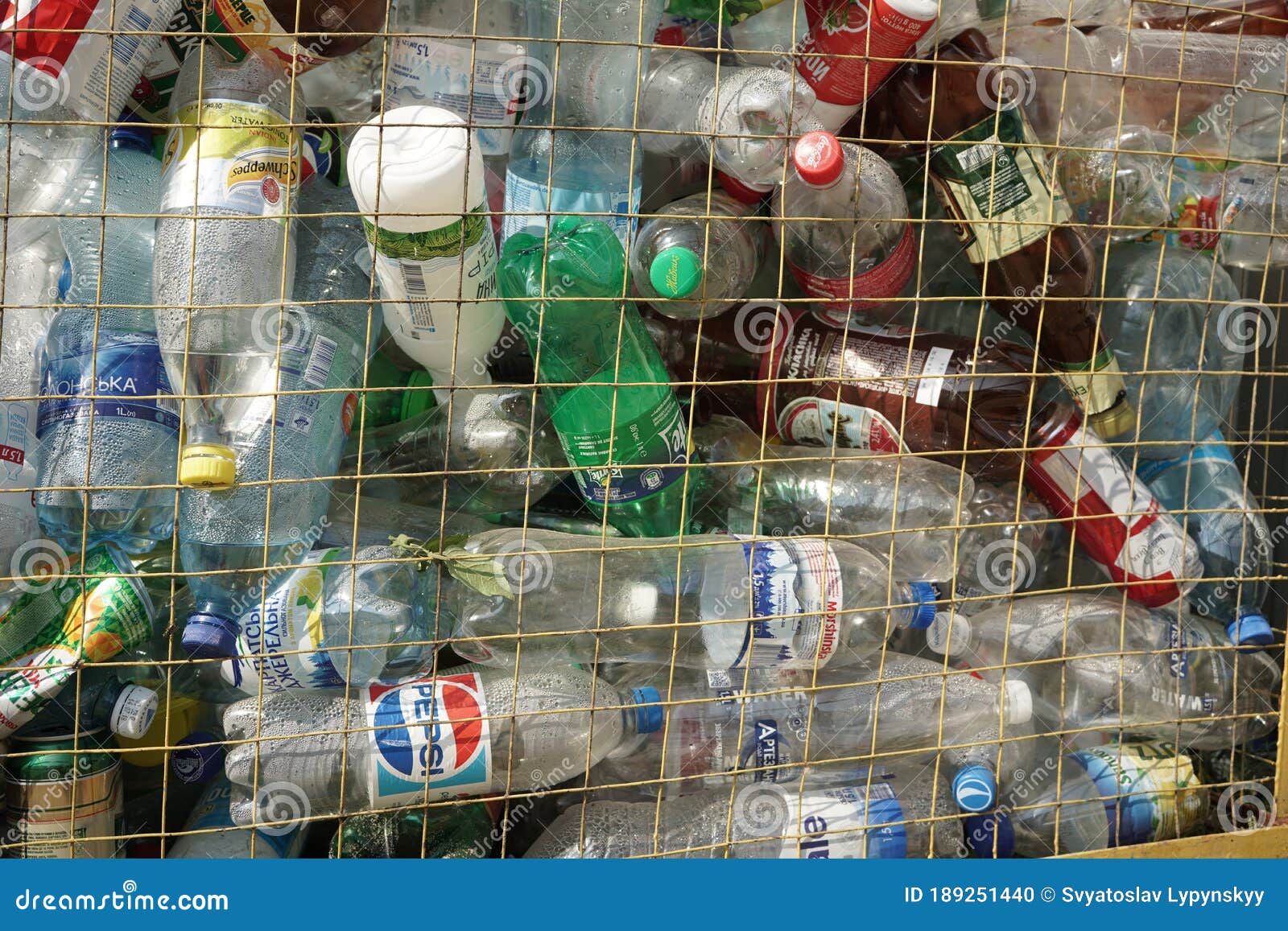 Plastic Bottles In A Trash Can Container With Bottles From Pepsi Sprite Schveppes And Also
