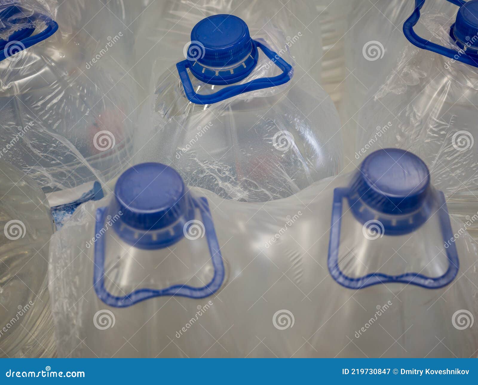 Plastic Bottles with Water Wrapped in Plastic Film Stock Image - Image ...