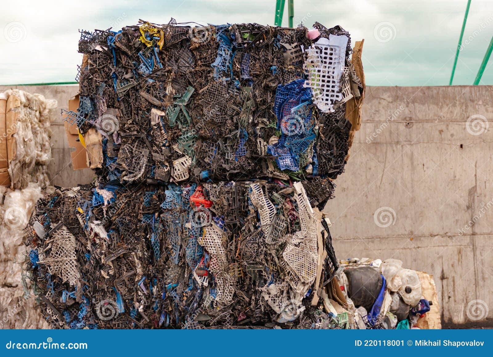 Plastic Boxes of Vegetables and Fruits are Pressed in a Garbage Factory ...