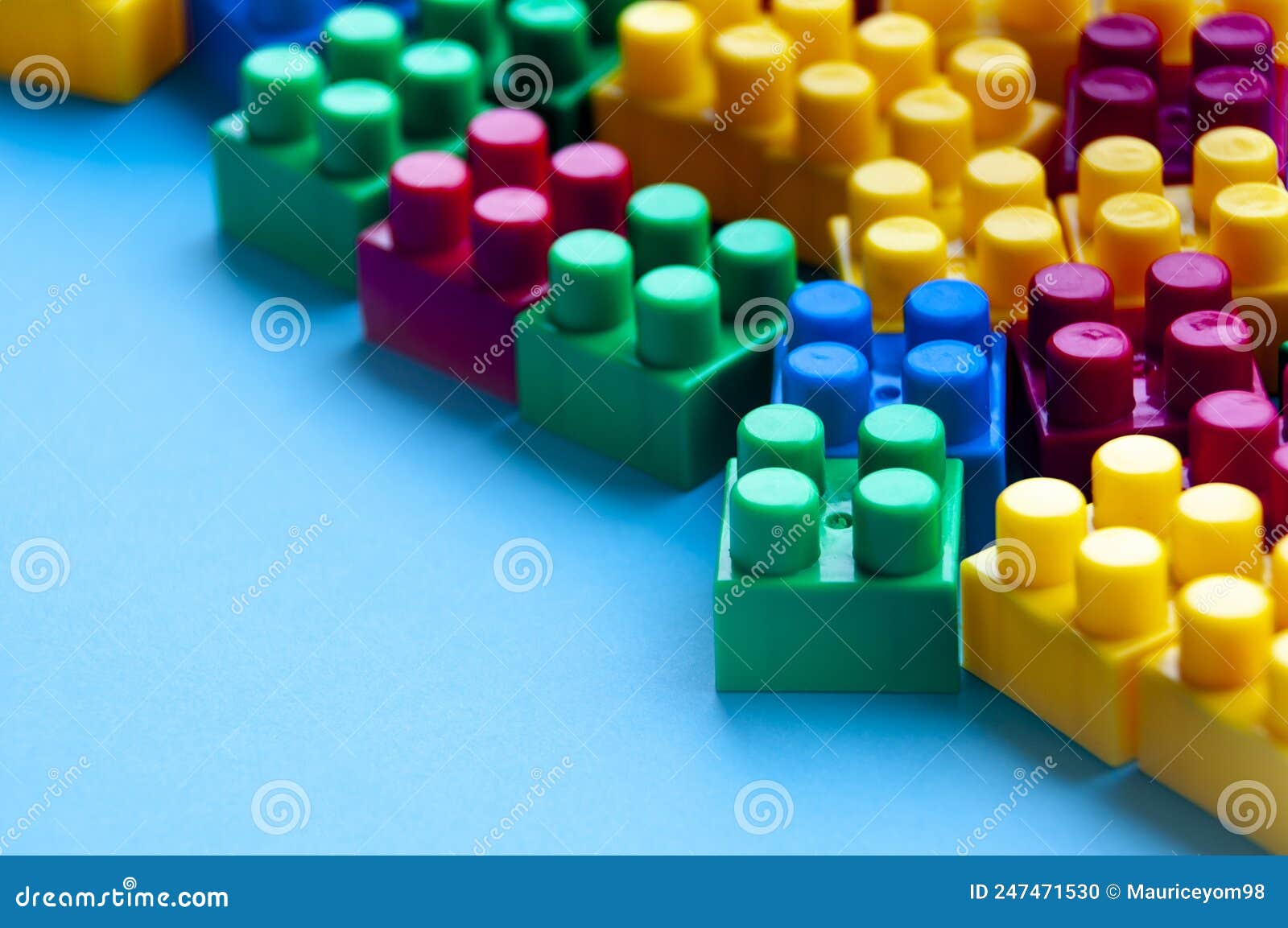 Plastic Building Blocks on Blue Background. Educational Concept Stock ...