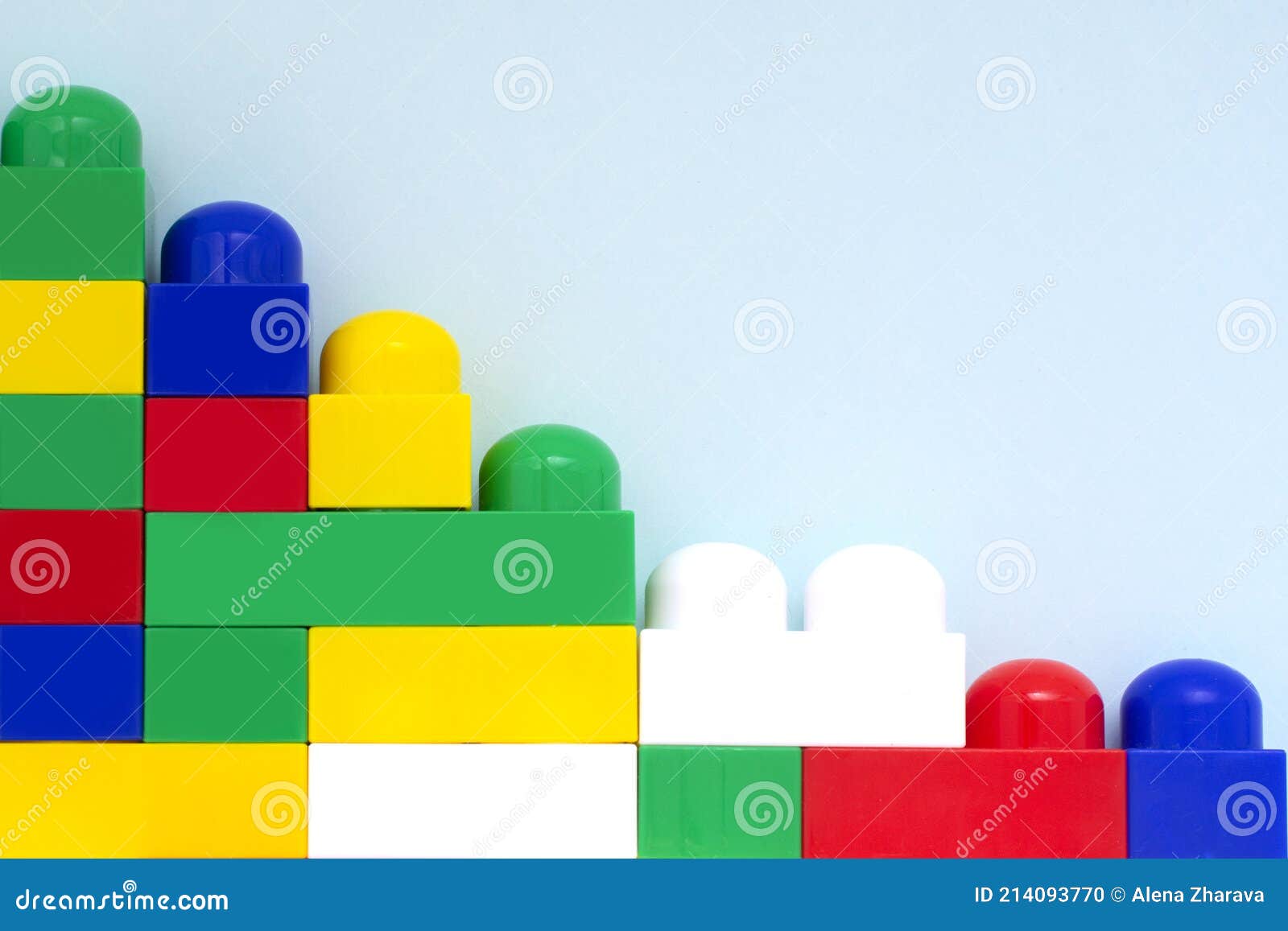 Plastic Building Blocks on a Light Blue Background. Children`s ...