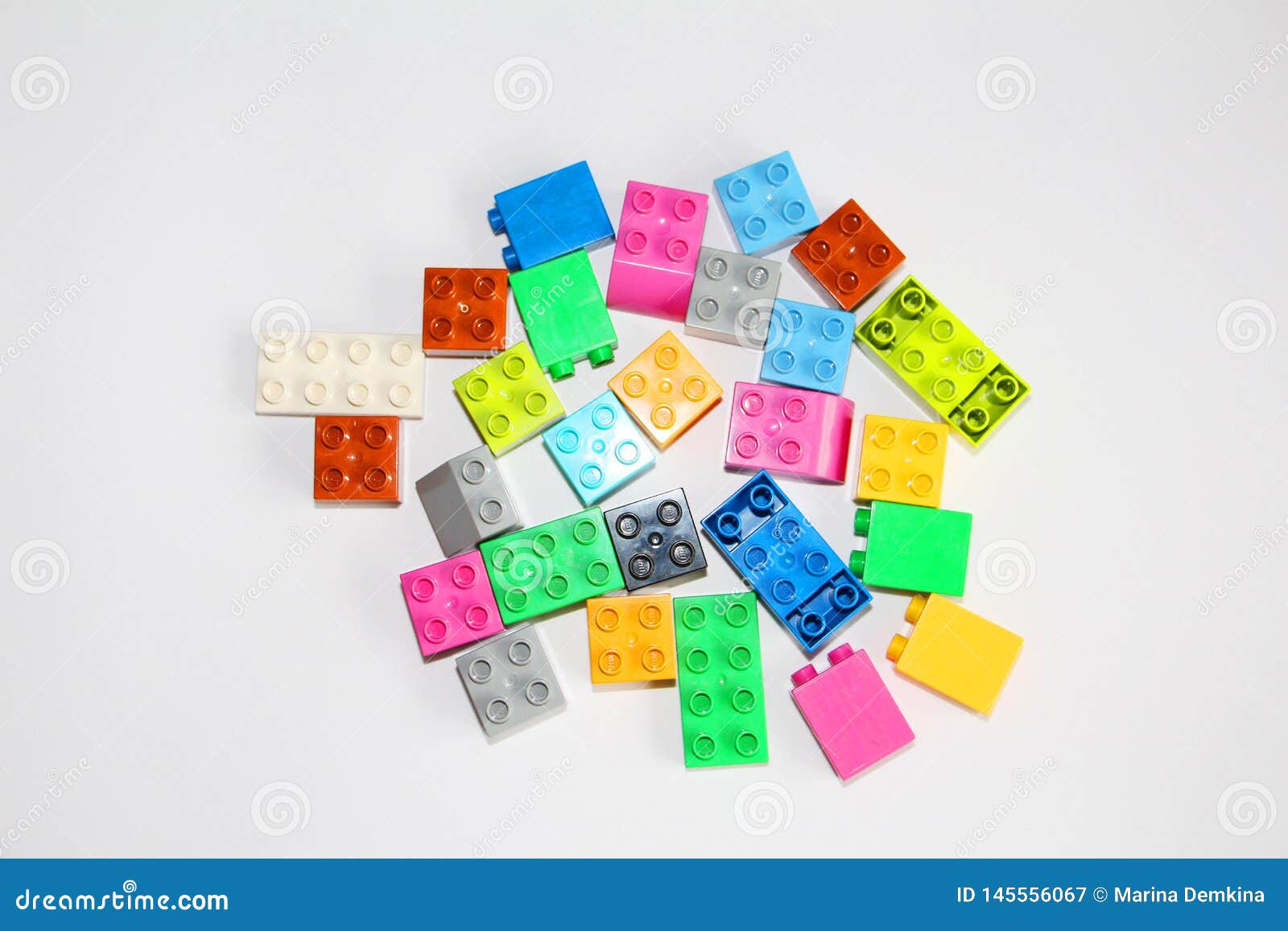 Plastic Building Blocks on a White Background. Multi-colored Cubes ...