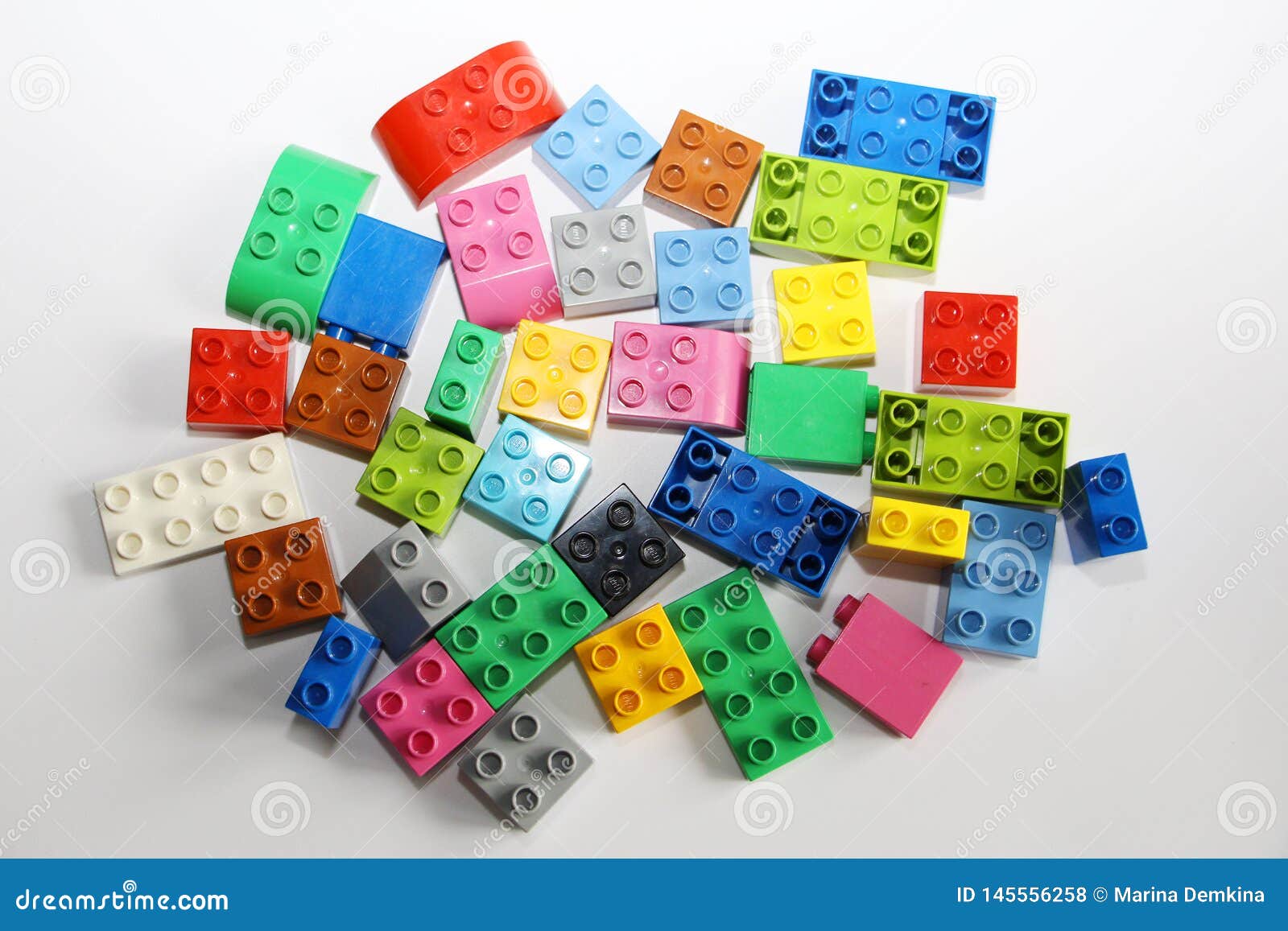Plastic Building Blocks on a White Background. Multi-colored Cubes ...