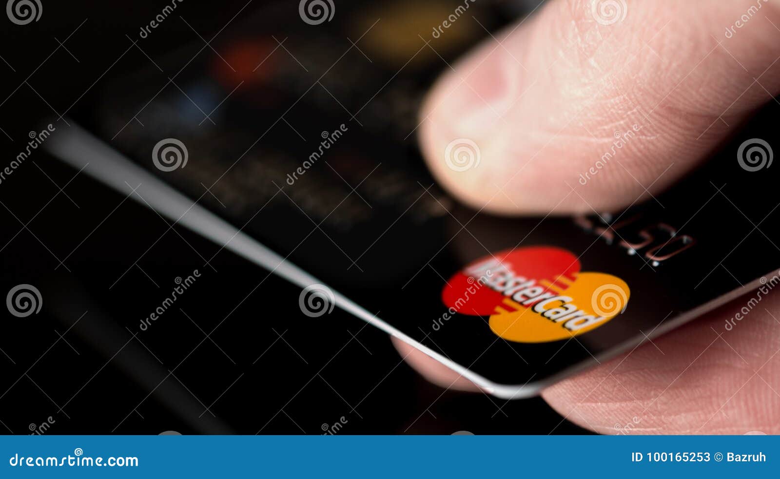 Mastercard in hand editorial stock photo. Image of electronic - 100165253