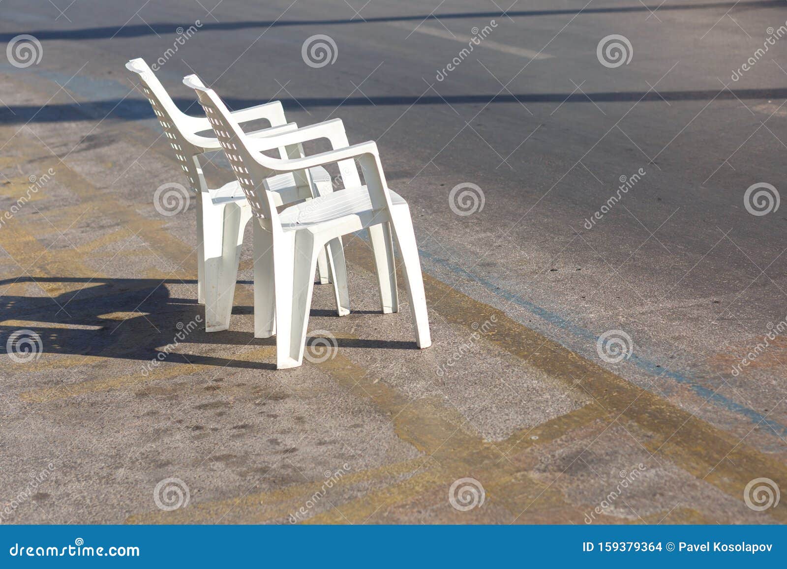 Plastic Chairs on the Pavement Stock Photo - Image of chair, travel ...
