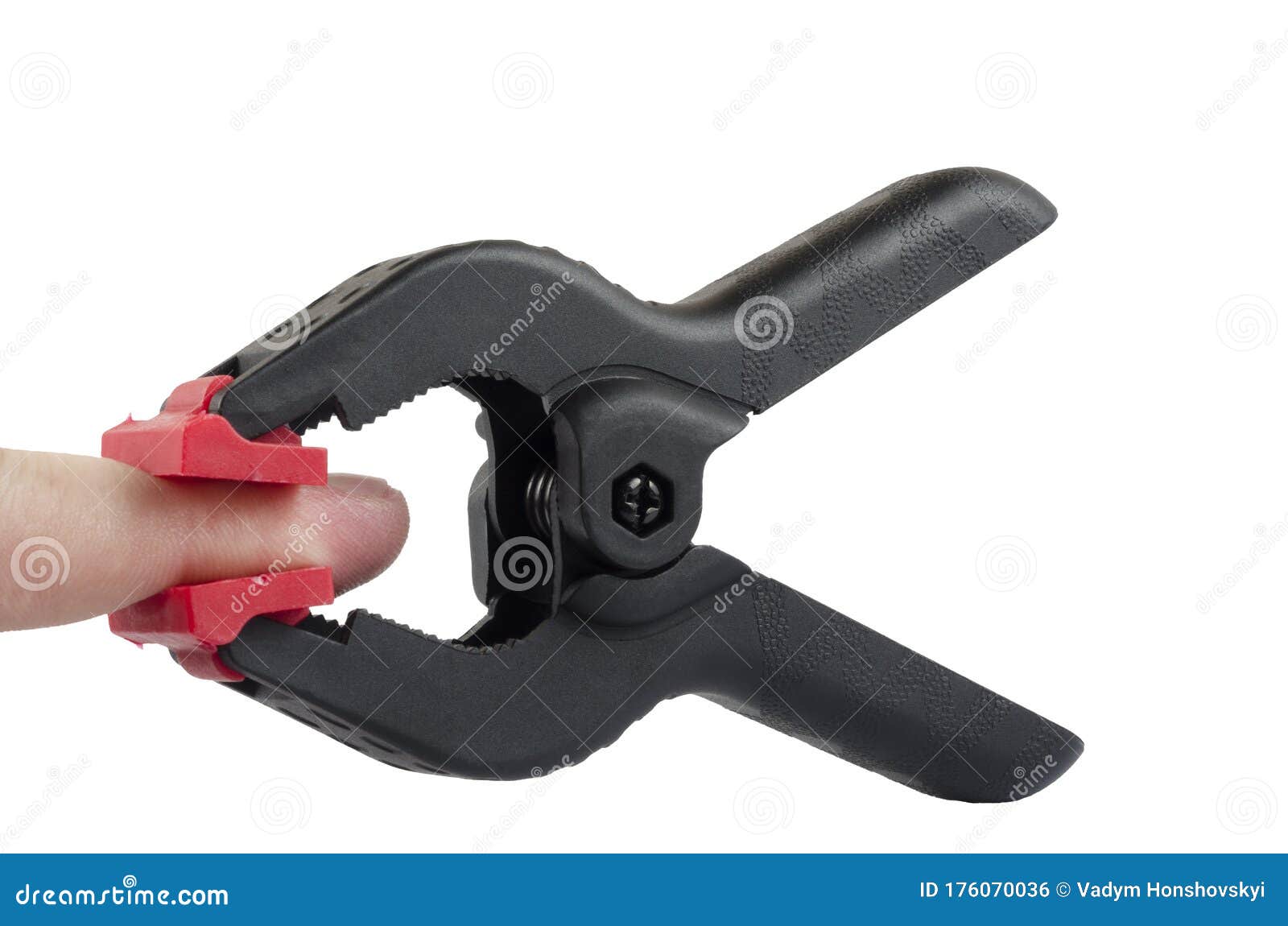 Plastic Clamps Squeezing Finger on a White Background Stock Photo ...