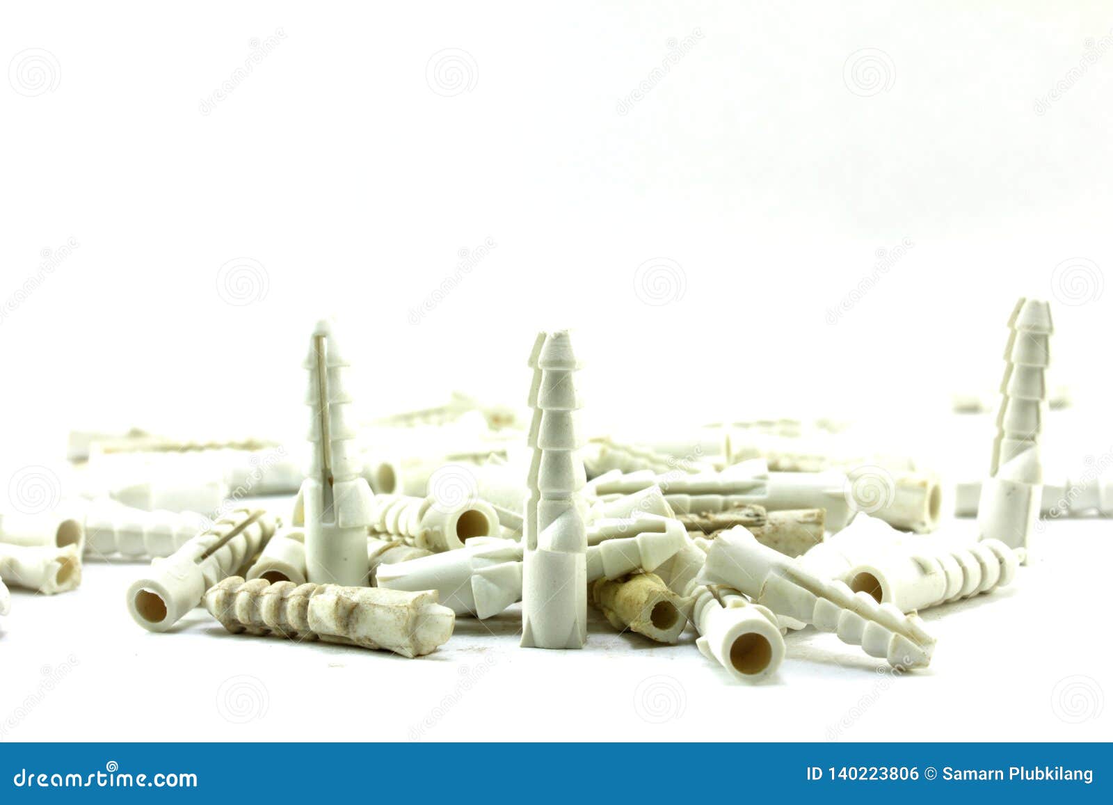 Plastic Cleat for Fixing the Nut and Wall on a White Background Stock ...