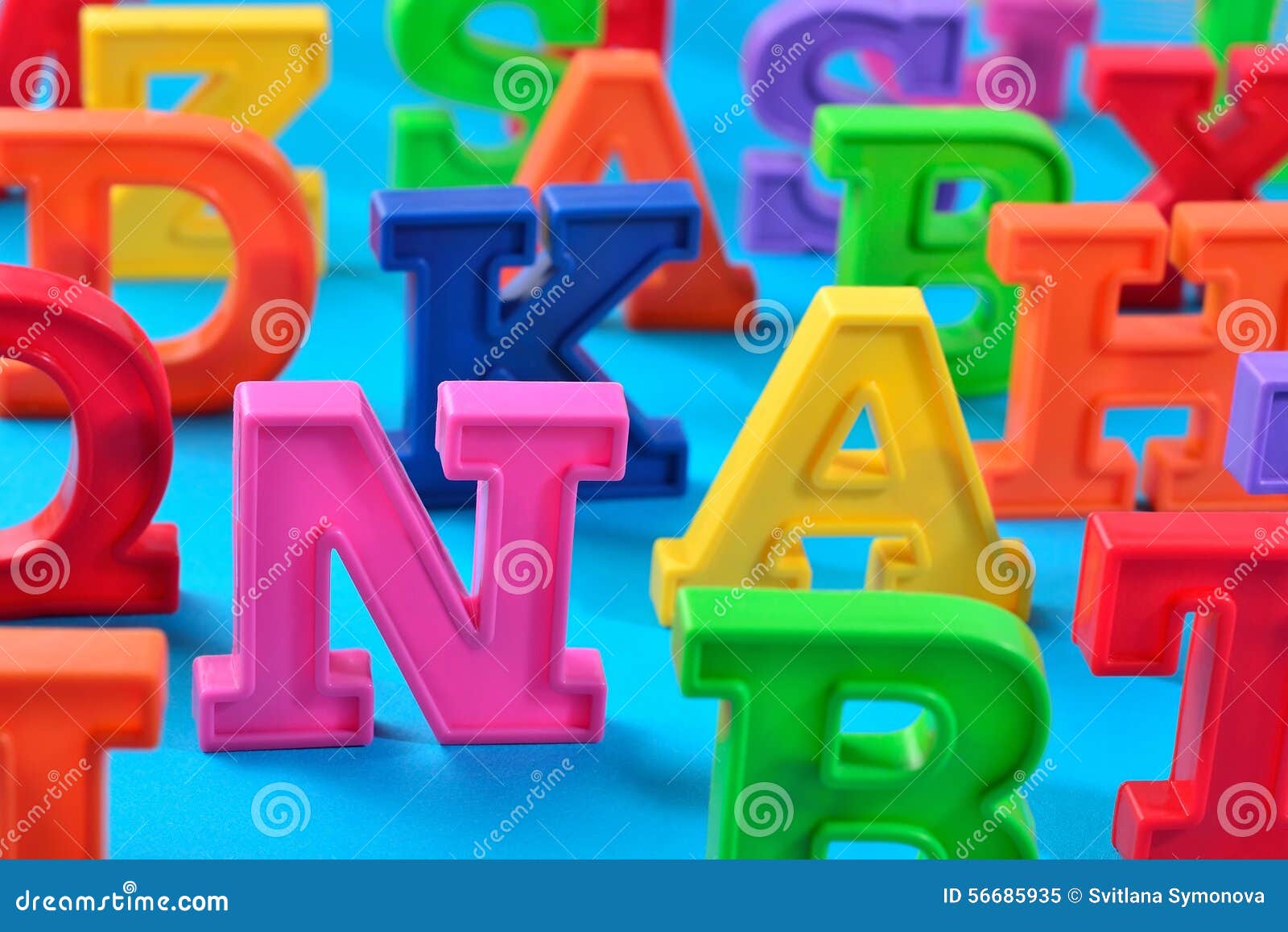 Plastic Colorful Alphabet Letters Close Up on a Blue Stock Image ...