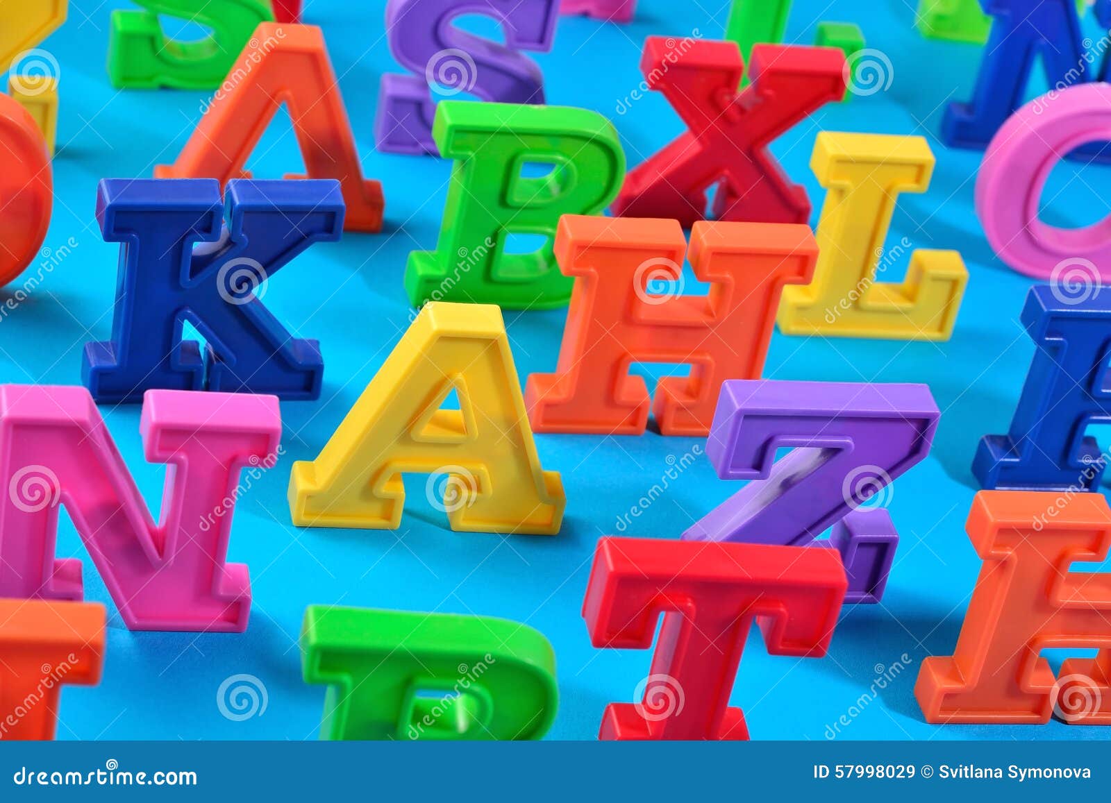 Plastic Colorful Alphabet Letters Close Up on a Blue Stock Image ...
