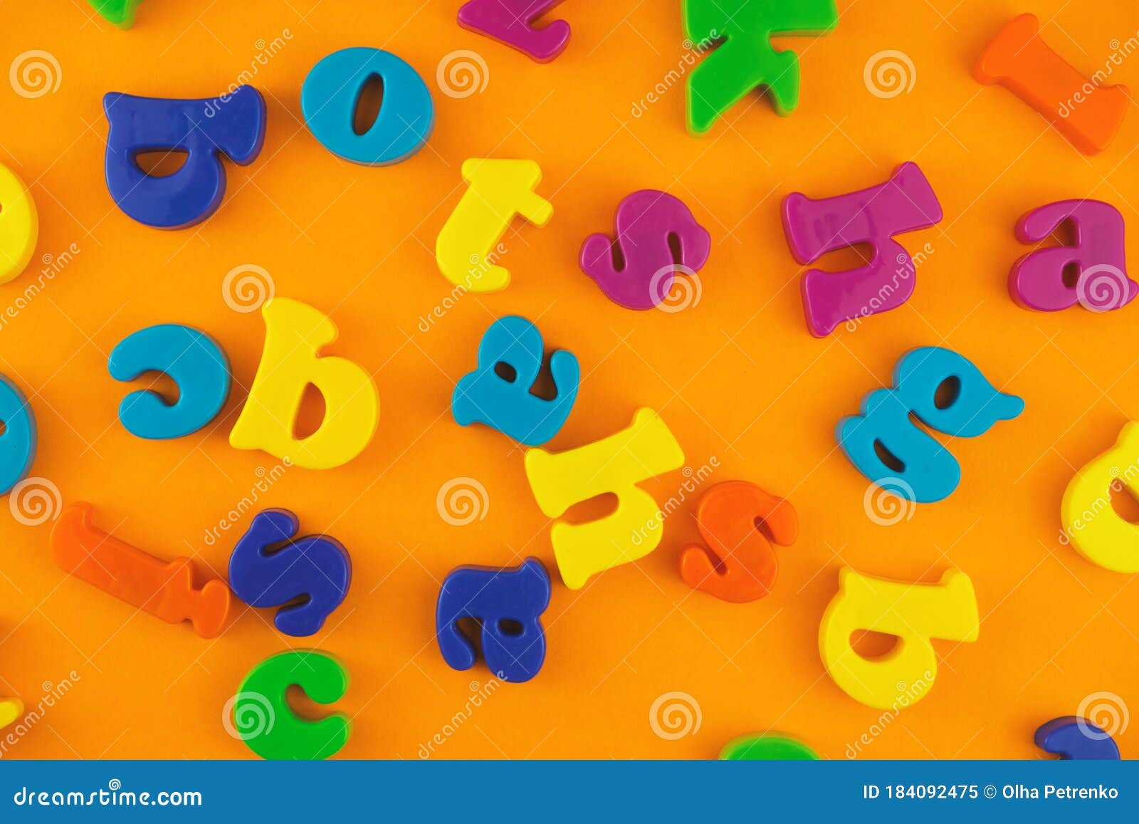 Plastic Colourful Alphabet Letters on the Orange Background Stock Image ...