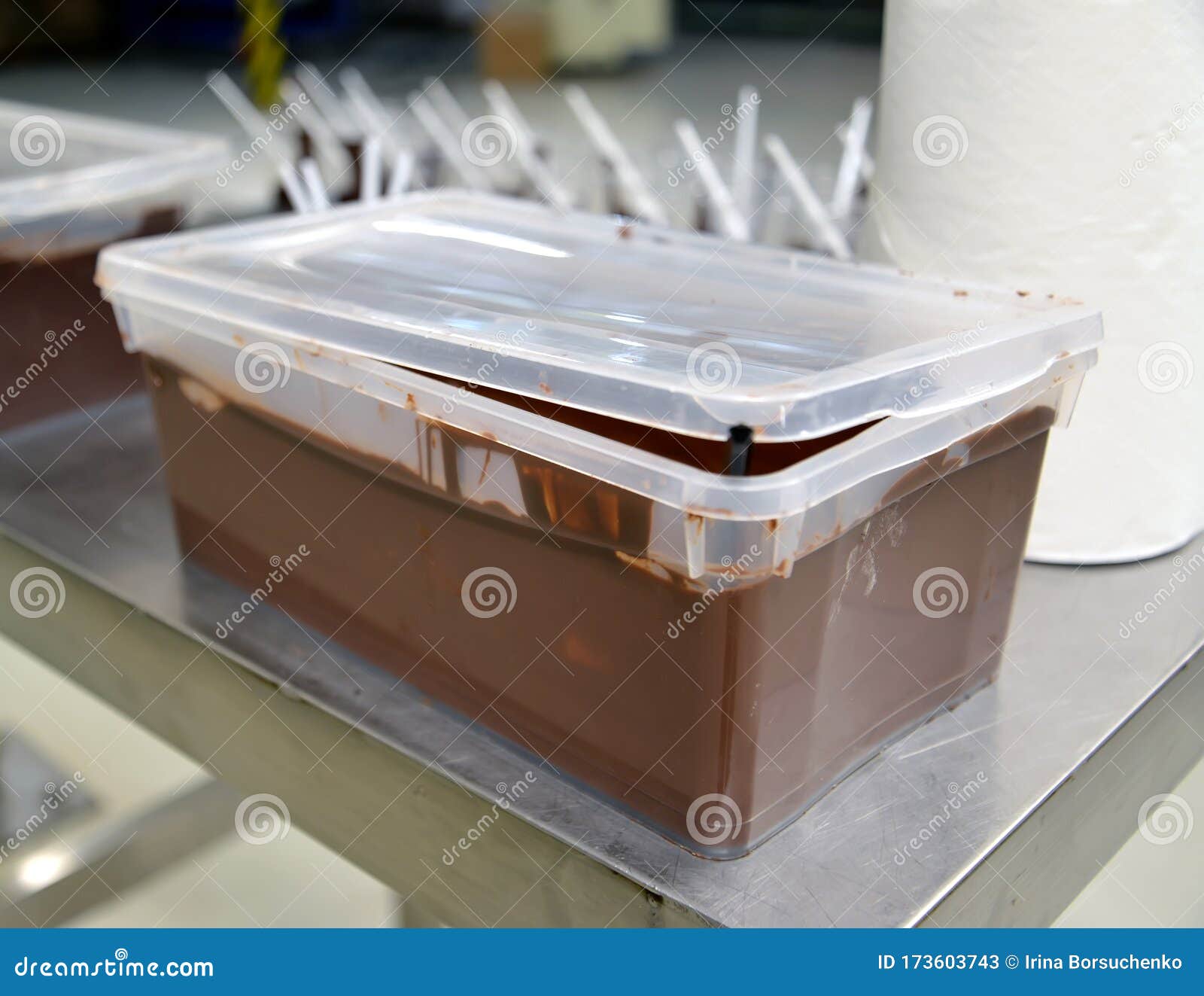A Plastic Container with Chocolate Mass Stands on the Tasting Table ...