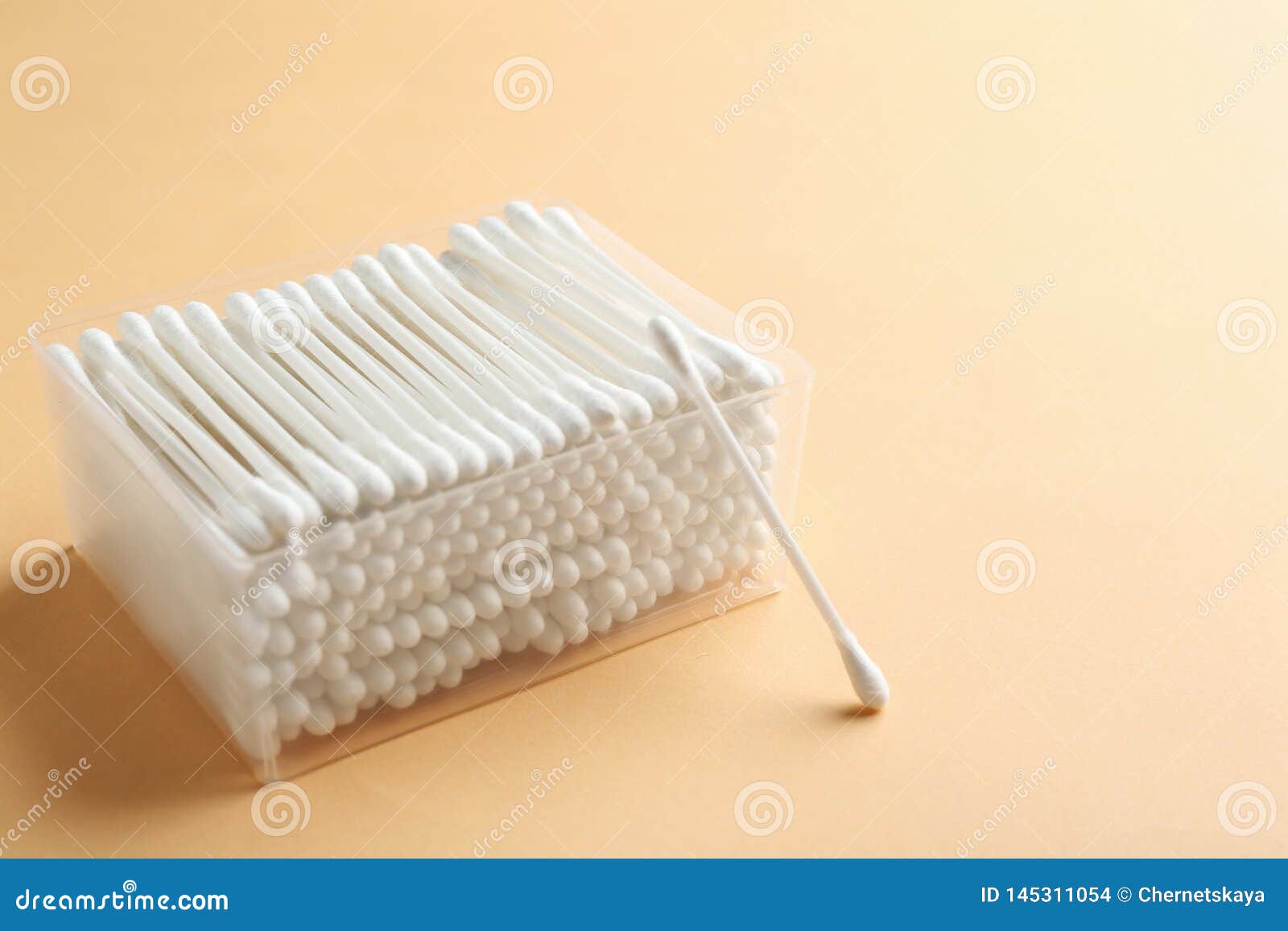 Plastic Container with Cotton Swabs on Color Background Stock Photo ...