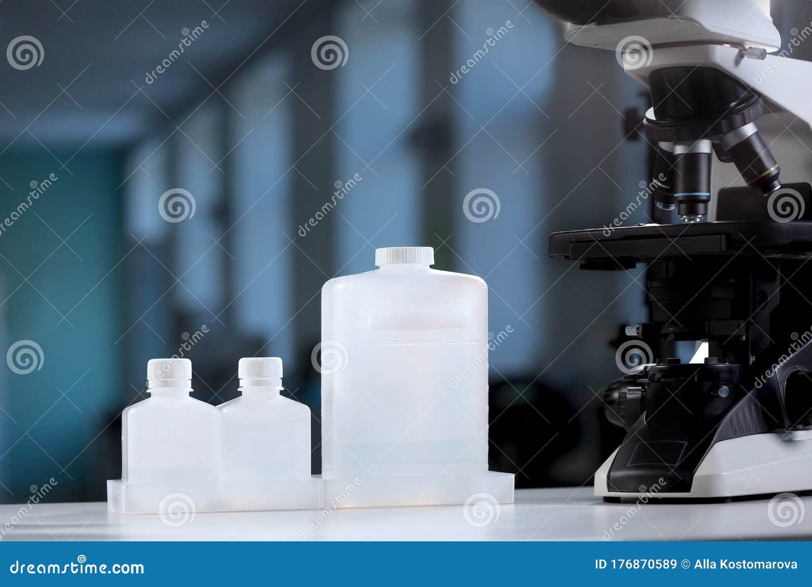 Plastic Containers in the Form of Bottles and a Microscope are on the ...