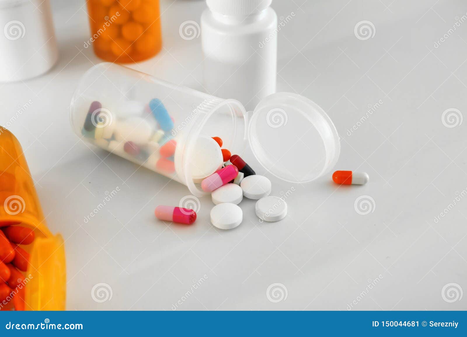 Plastic Containers with Pills on Table Stock Image - Image of ...