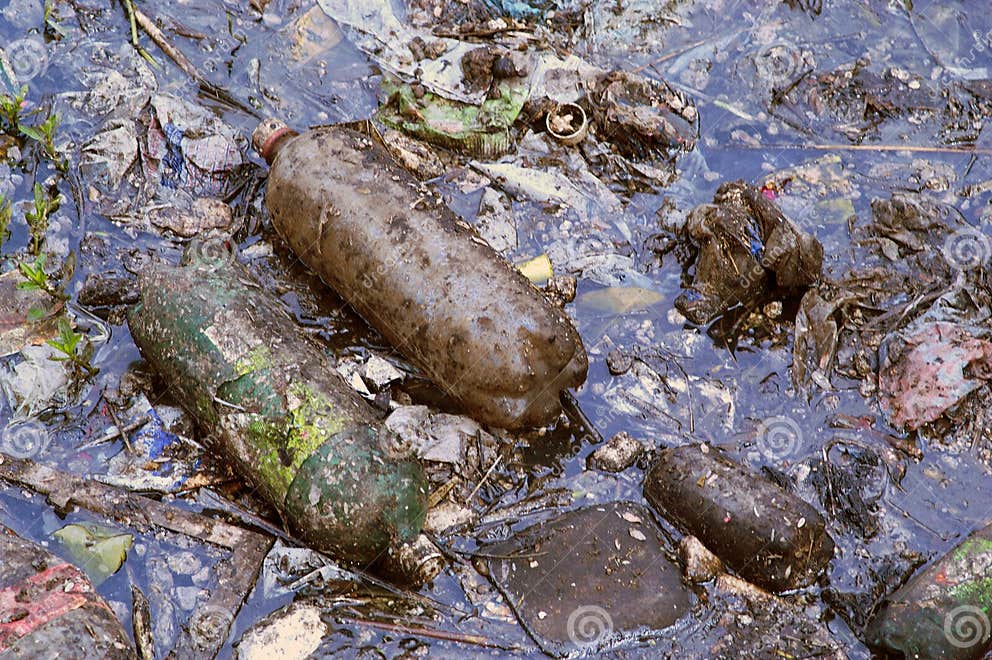 Plastic Contamination into Nature. Garbage and Bottles Floating on ...