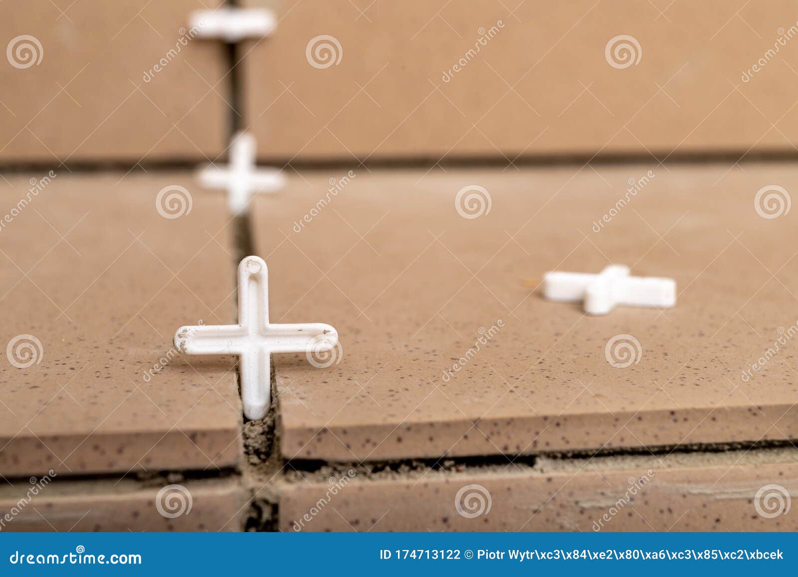 Plastic Crosses that Position the Tiles when Laying. the Process of ...