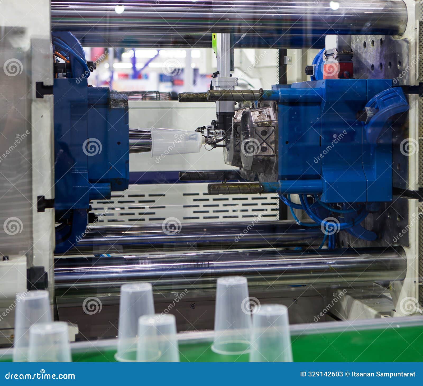 Plastic Cups from Plastic Injection Molding Press Machine Stock Image ...