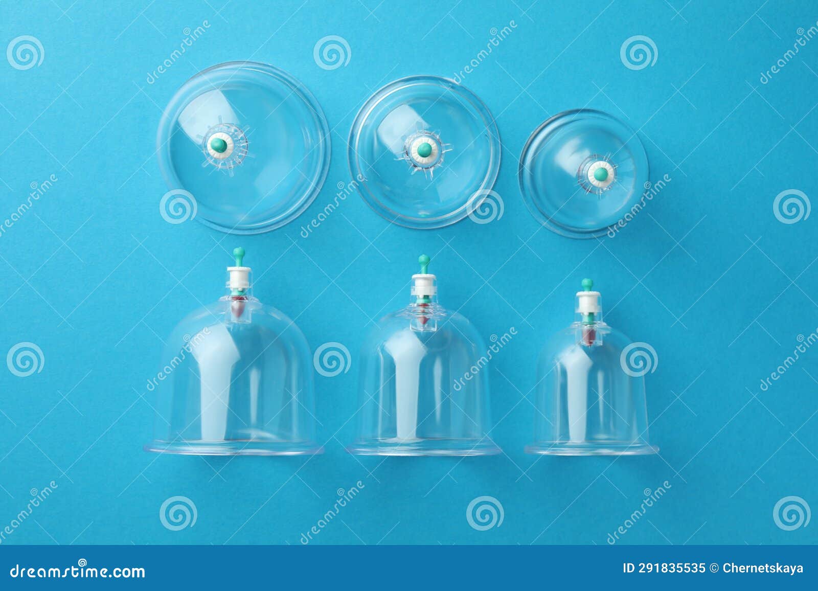 Plastic Cups on Light Blue Background, Flat Lay. Cupping Therapy Stock ...