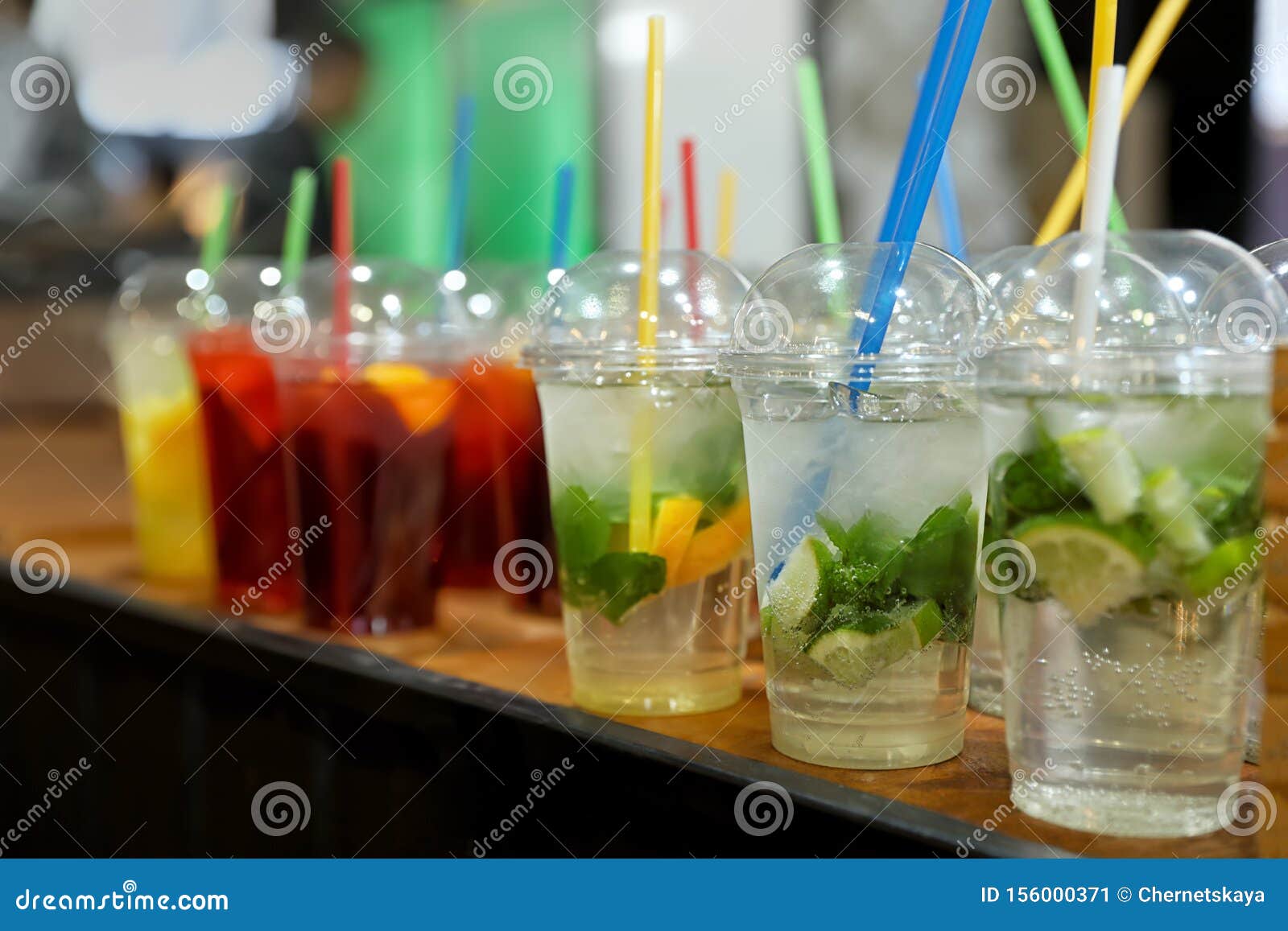 Plastic Cups with Refreshing Drinks on Bar Stock Image - Image of ...