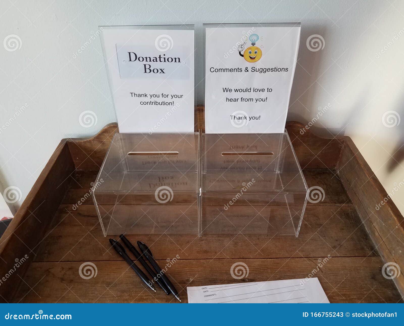 Plastic Donation and Comment Box with Pen and Paper on Desk Stock Image ...