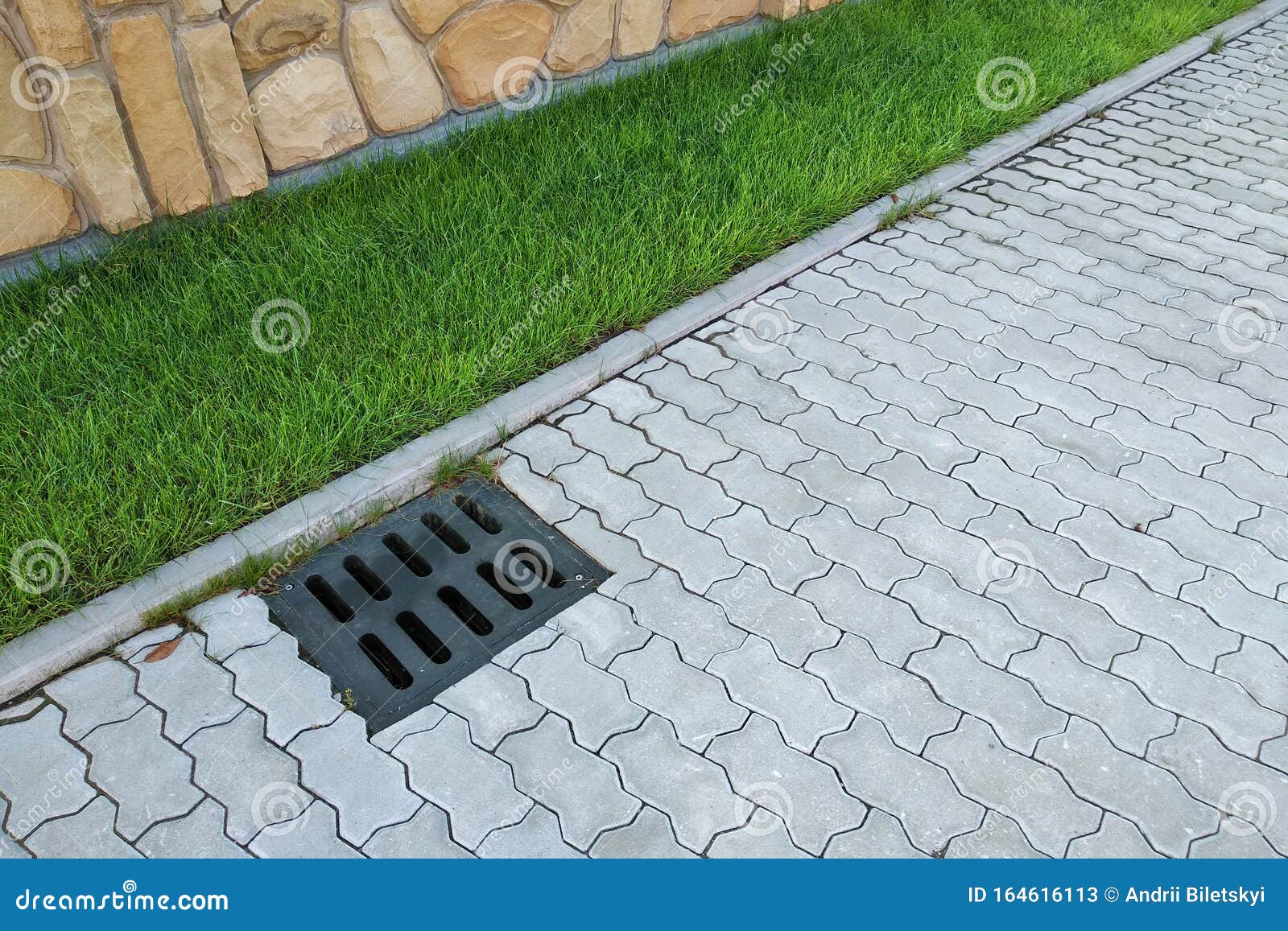 Plastic Drain Gutter, Green Grass Lawn and Stone Pavement Sidewalk ...