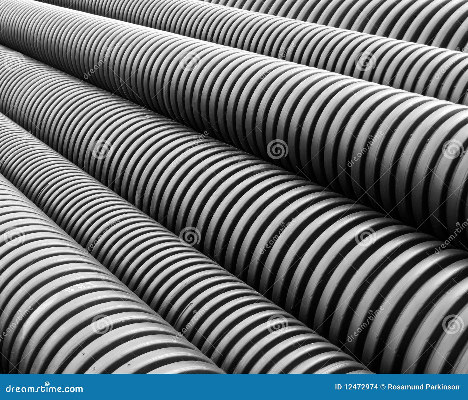 Plastic Storm Water Outlet With Rip-rap Protruding From A Grass ...