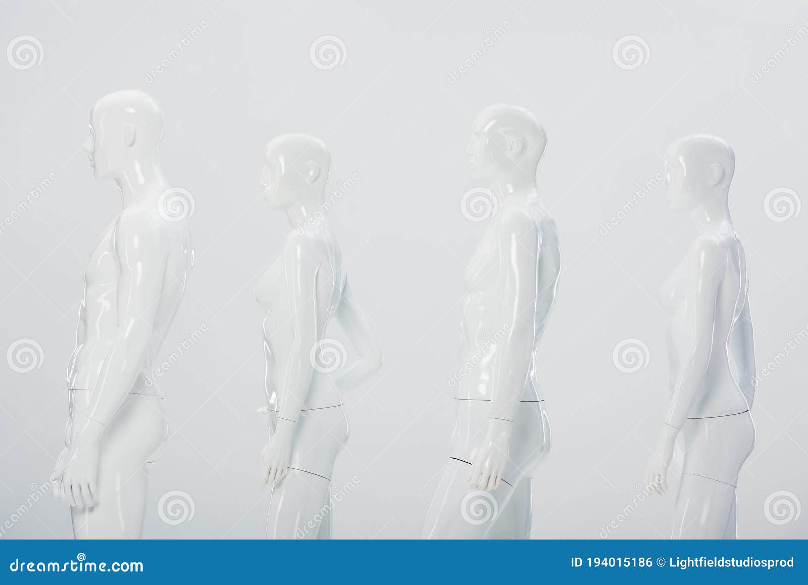 Plastic Dummies in Row Isolated on Grey Stock Photo - Image of ...