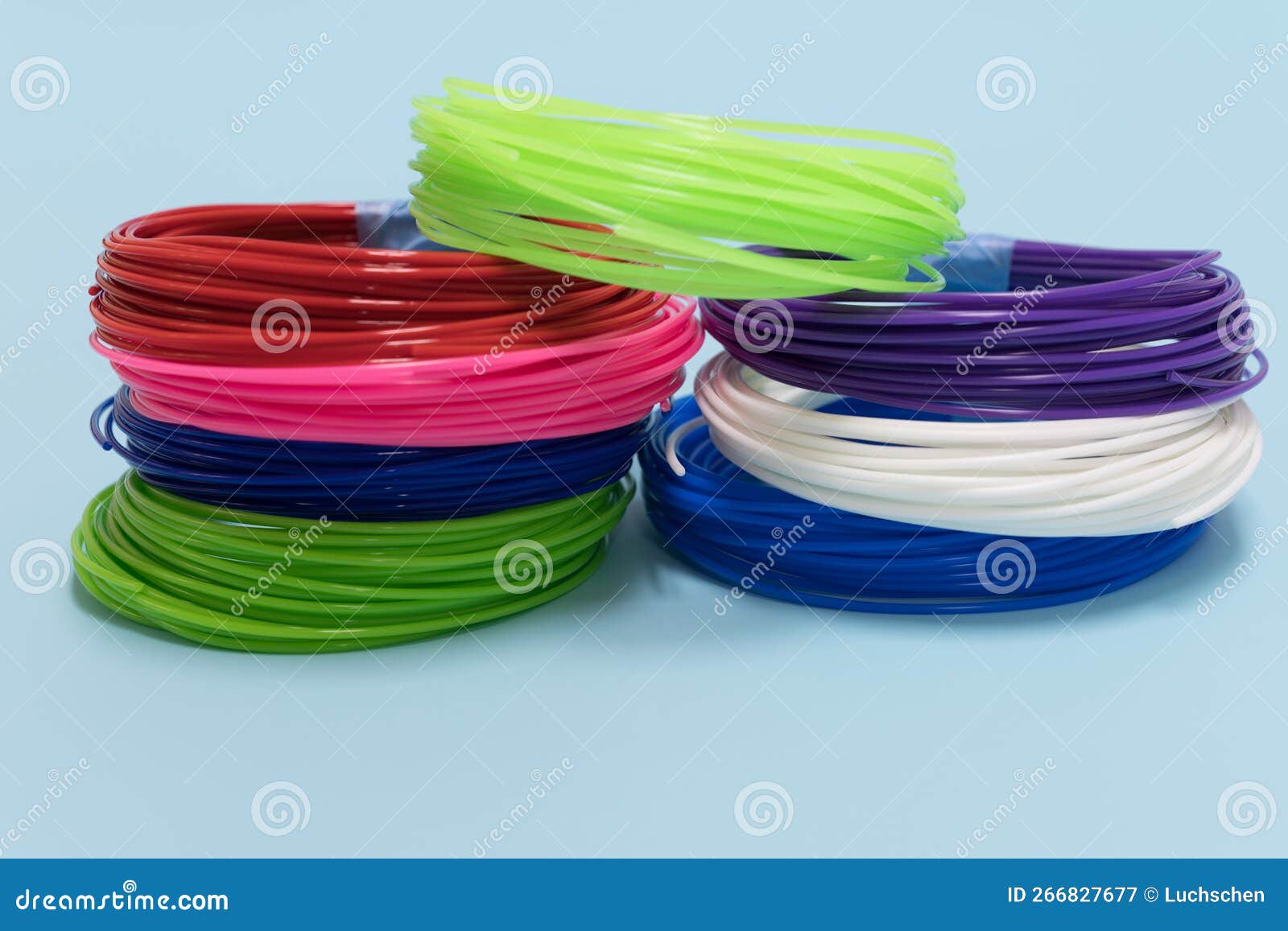 Plastic Filament of Different Colors for 3D Printing on a Blue ...