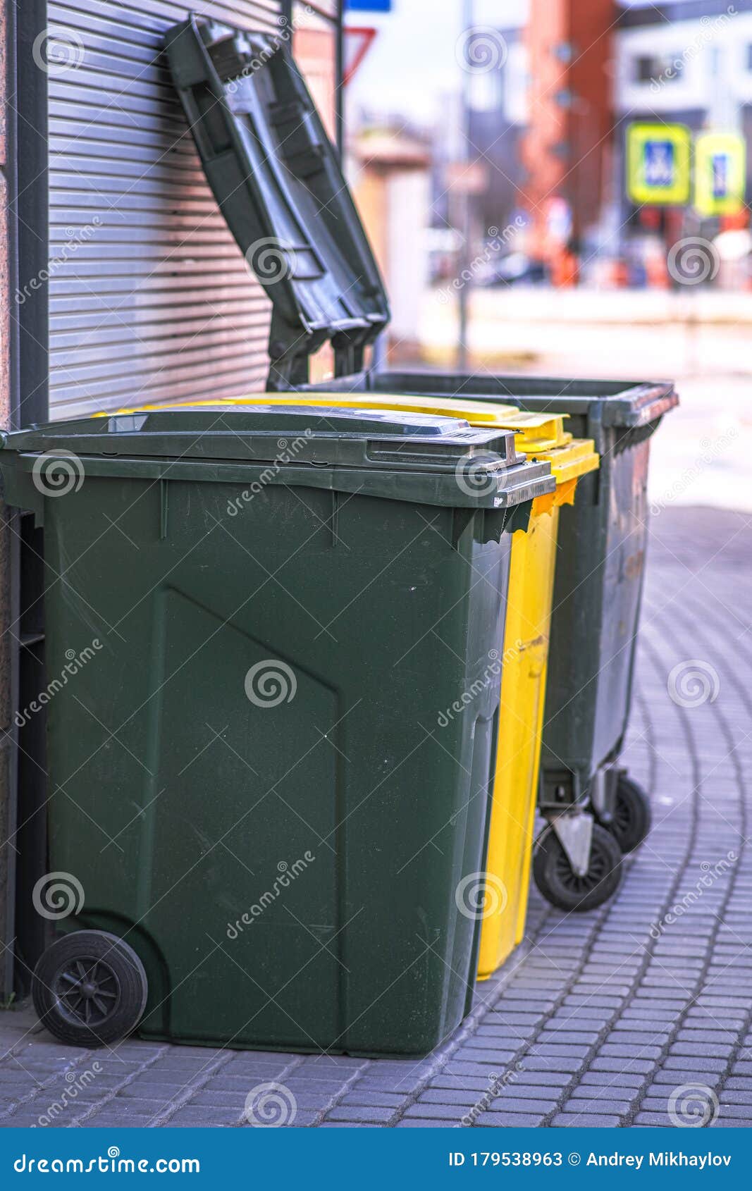 Plastic Garbage Containers on the Street of the City, Standing Against ...