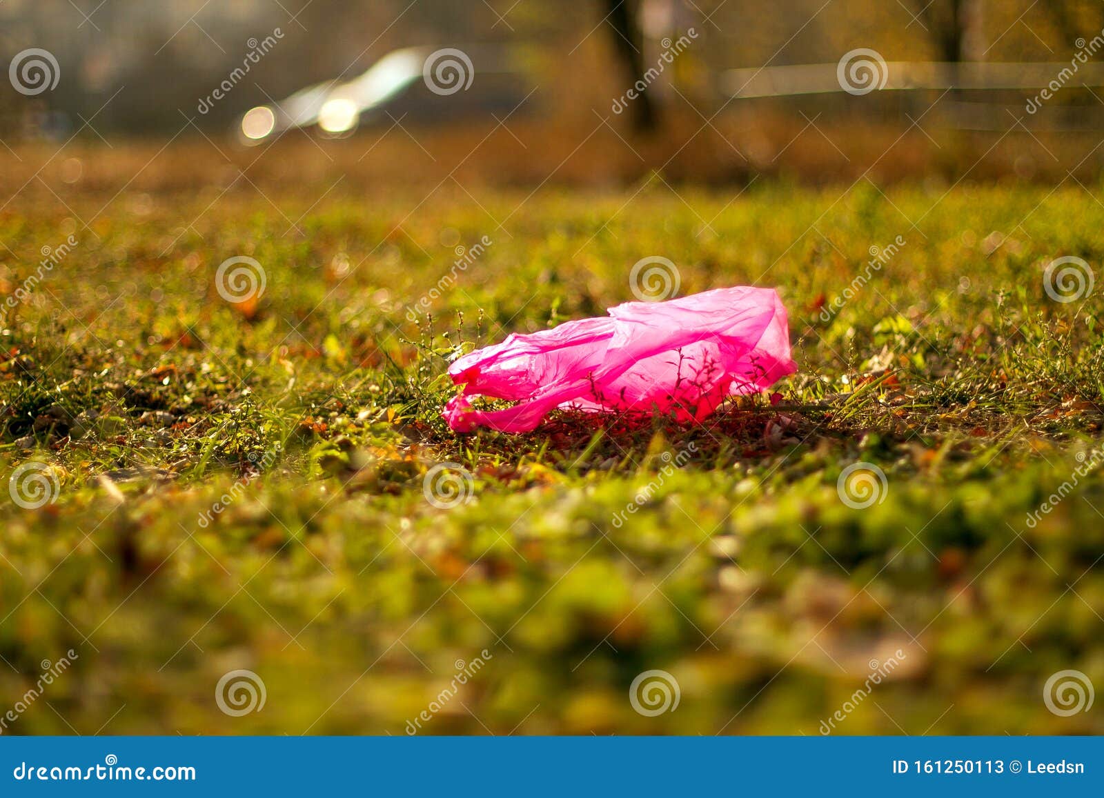 Plastic Garbage Packet on the Green Grass Stock Image - Image of ...