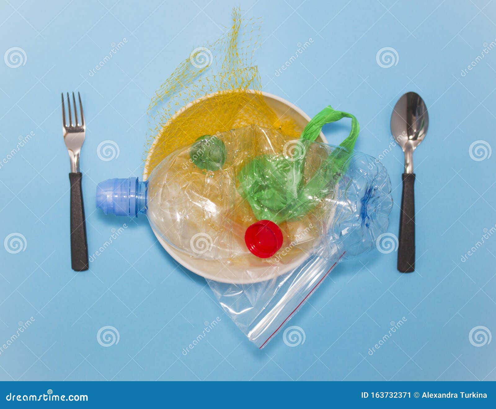 Plastic Garbage on a Plate, Next To a Fork and Spoon. Environment ...