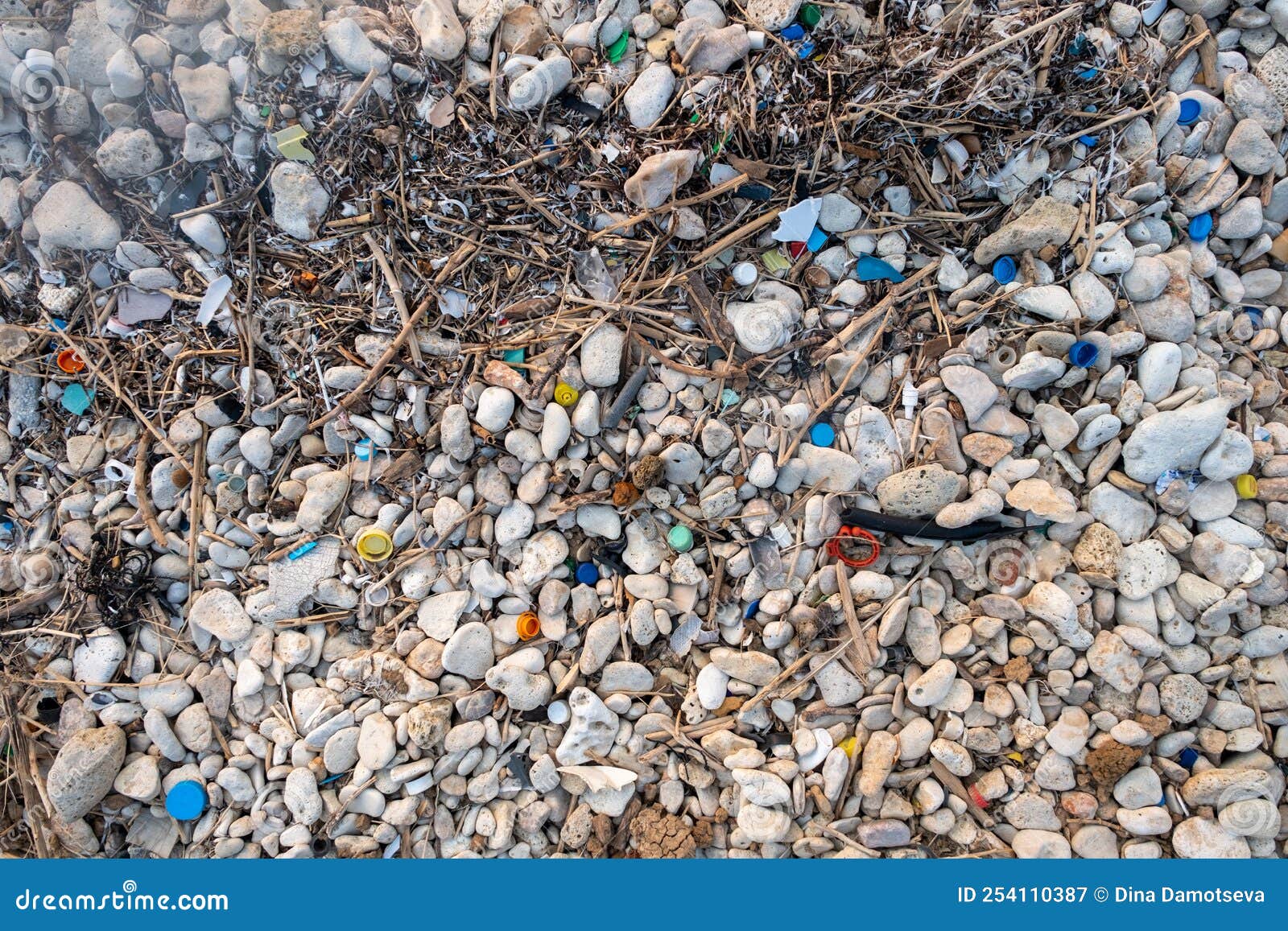 Plastic Garbage on the Seashore. Top View of a Polluted Beach. Stones ...