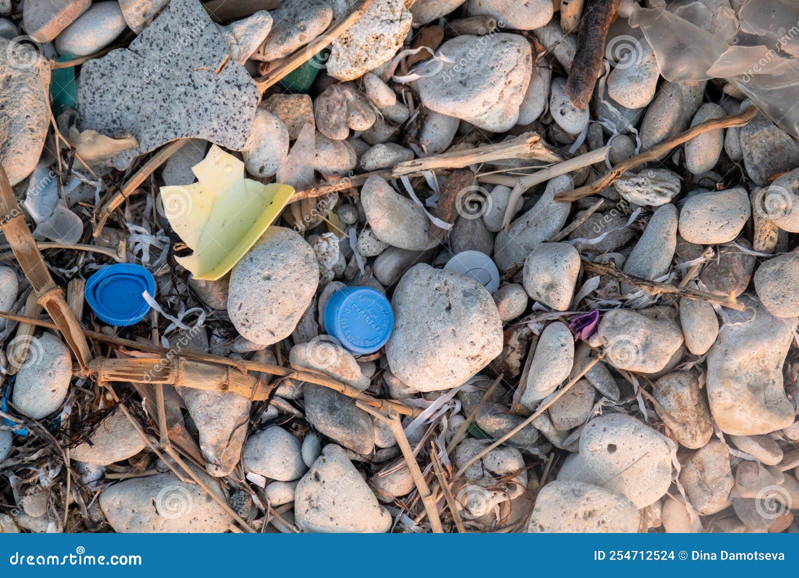 Plastic Garbage on the Seashore. Top View of a Polluted Beach. Stones ...
