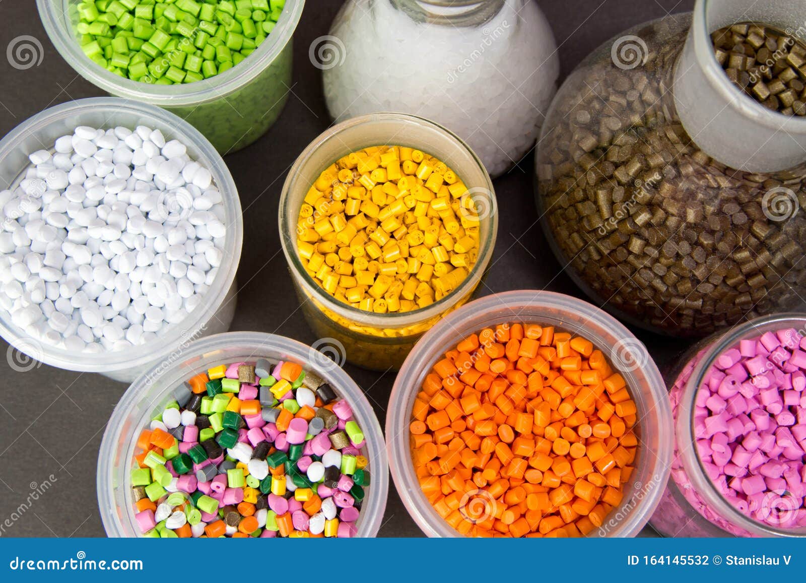 Plastic Granules in a Measuring Container and Test Tubes in the ...