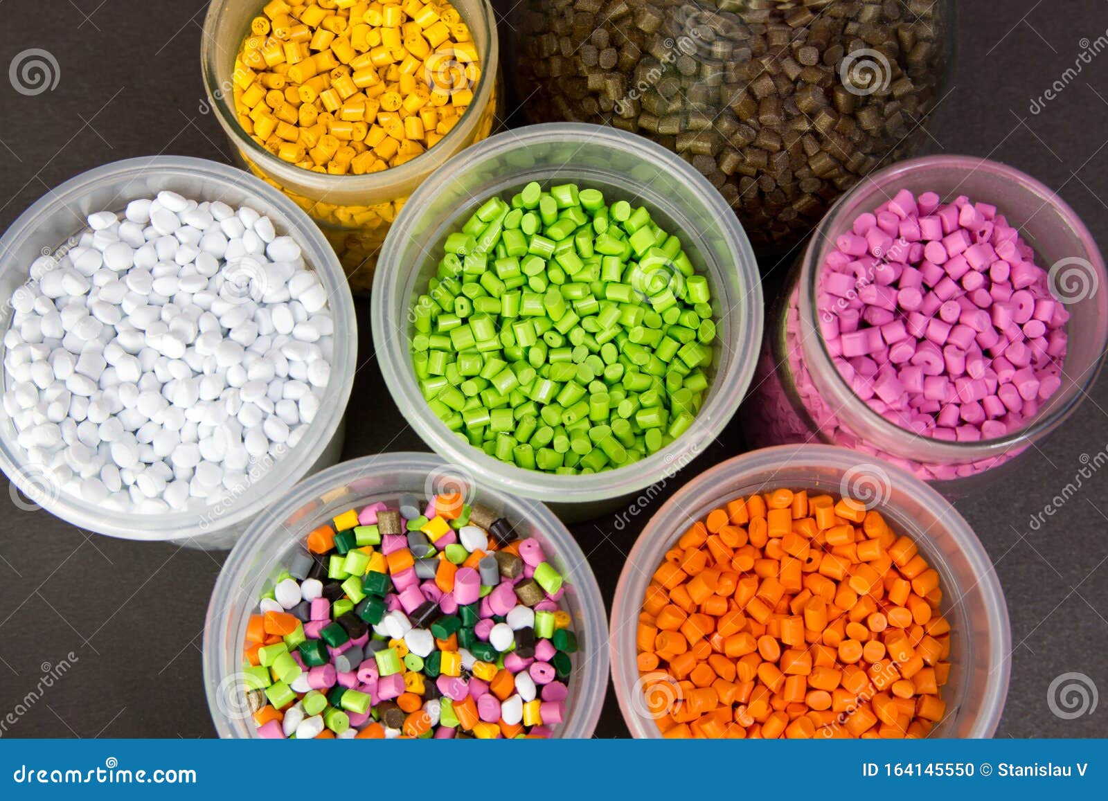 Plastic Granules in a Measuring Container and Test Tubes in the ...
