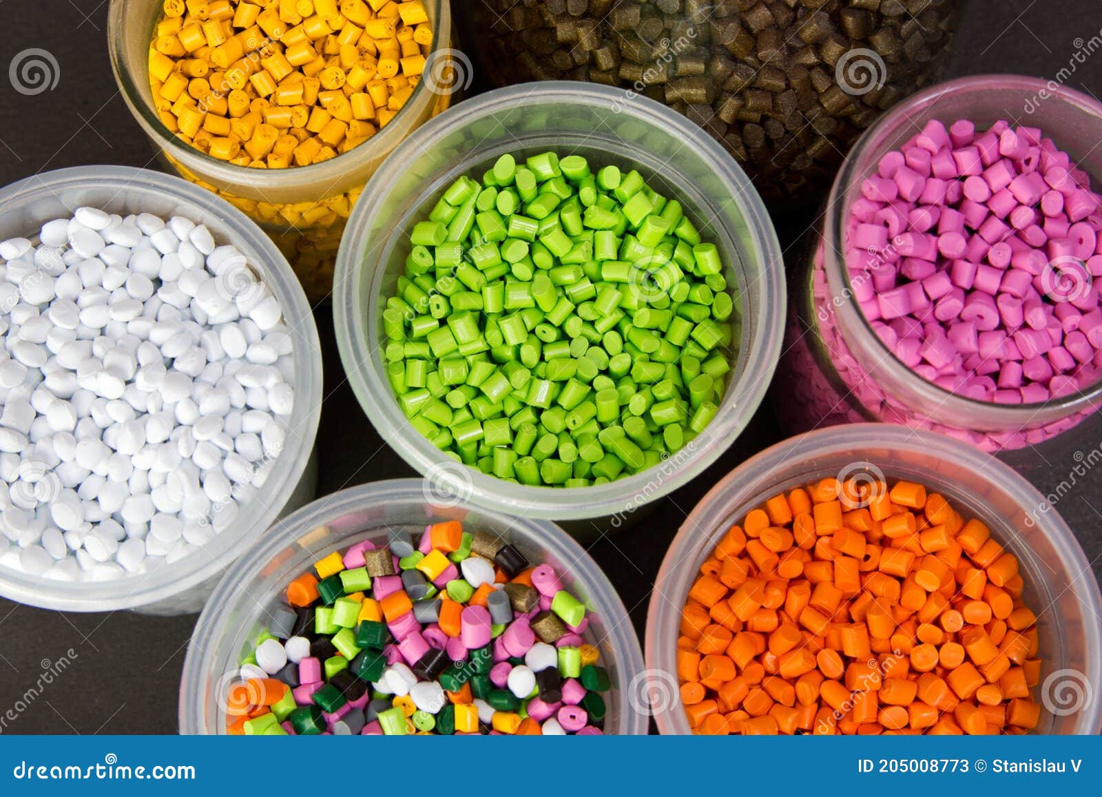 Plastic Granules in a Measuring Container and Test Tubes in the ...